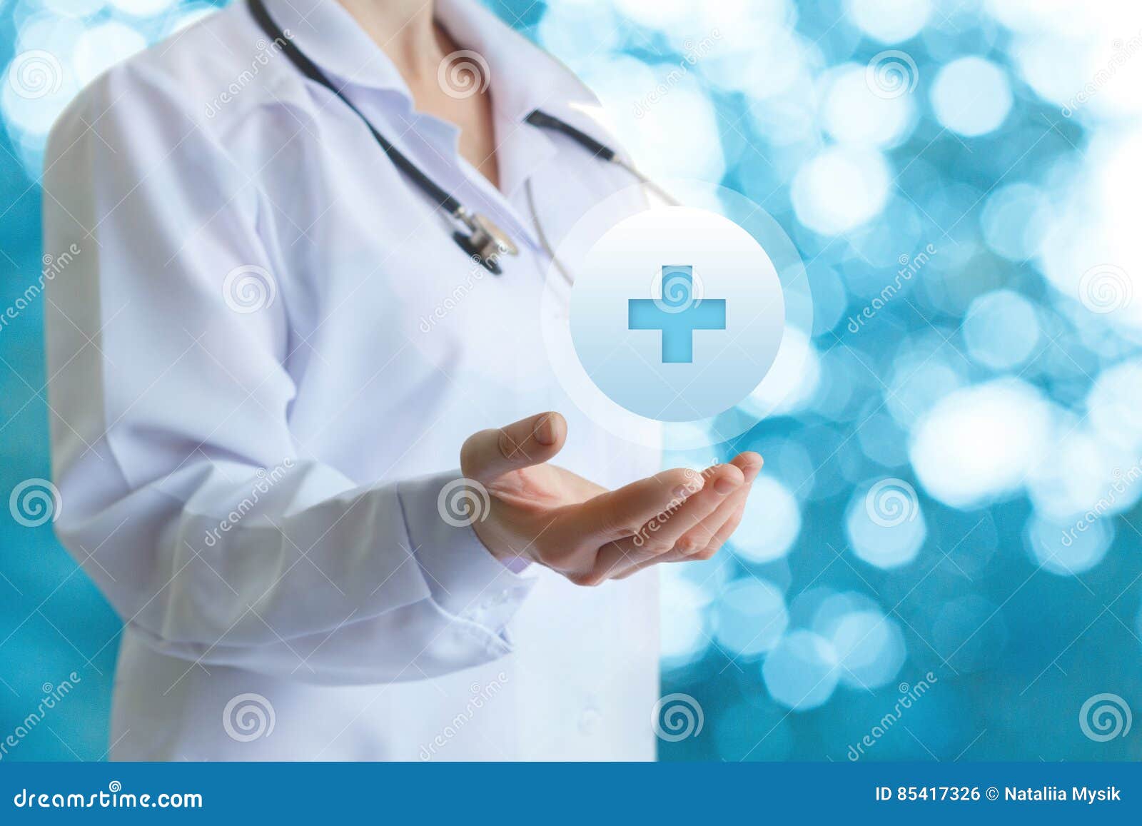 Doctor holding a cross. stock photo. Image of hospital - 85417326