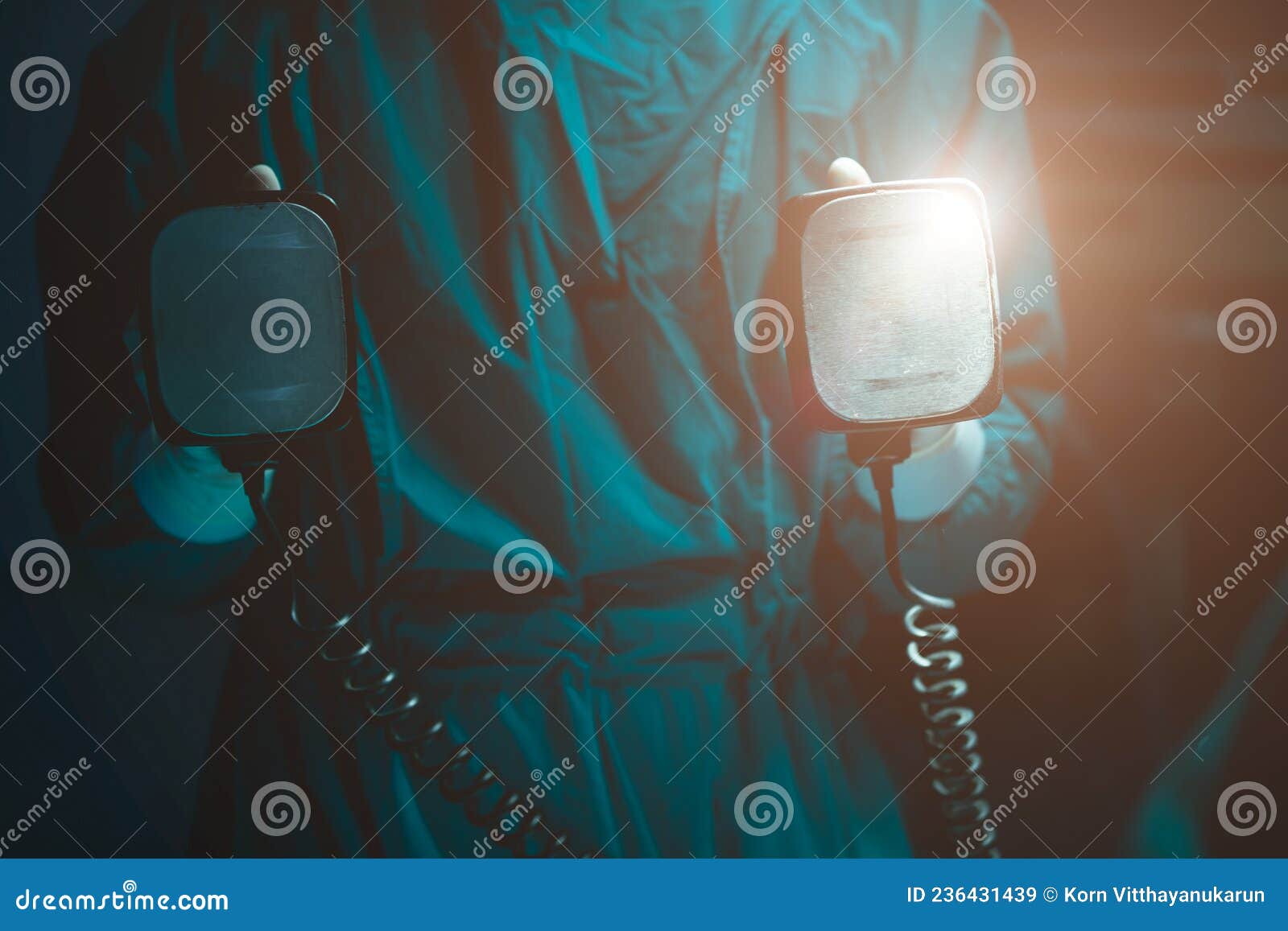 Doctor Holding Manual Defibrillator for Pulse Generator in Operating ...