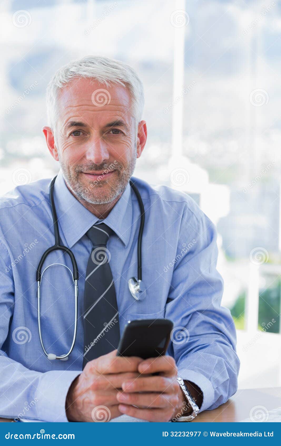 Doctor Holding a Mobile Phone Stock Image - Image of mobile, caucasian ...