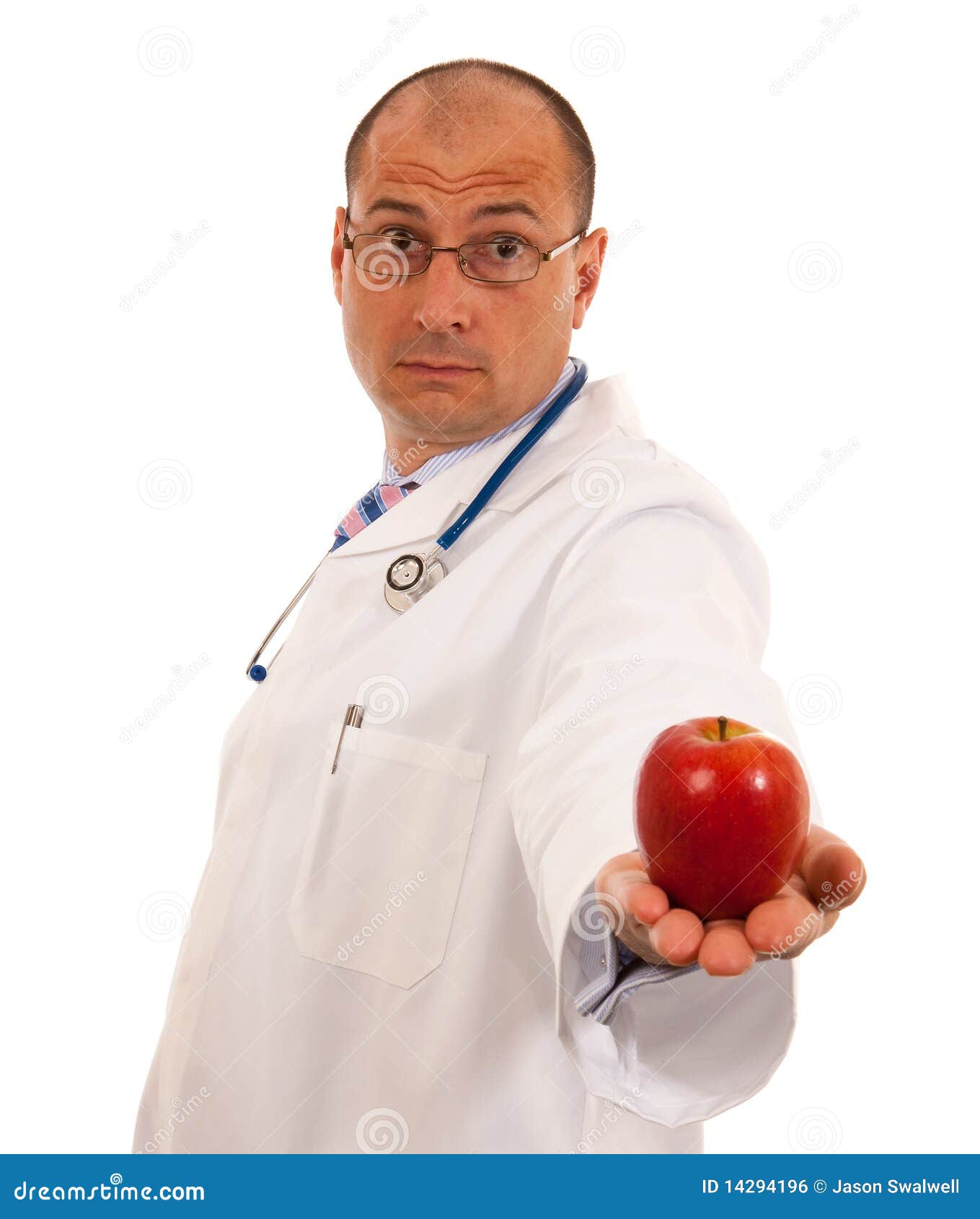 Doctor Holding Out An Apple Royalty Free Stock Image - Image: 14294196