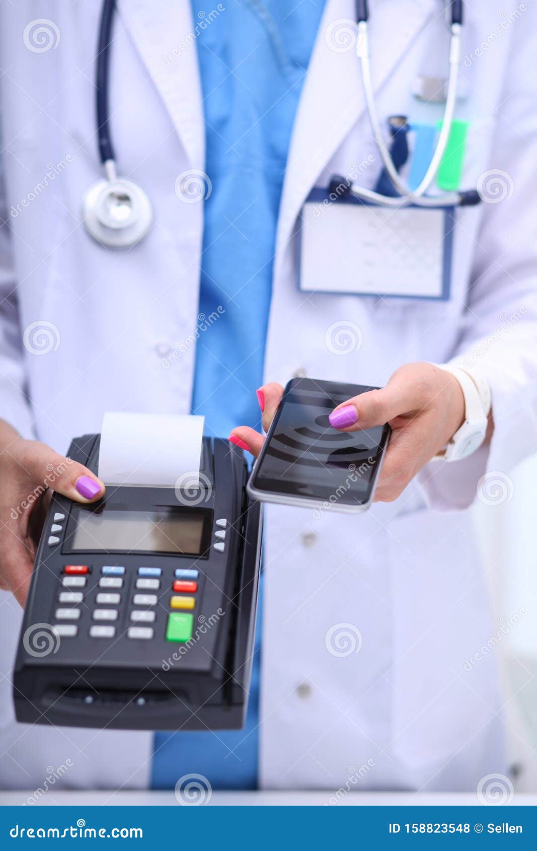 Doctor is Holding Payment Terminal in Hands. Paying for Health Care ... Doctor is Holding Payment Terminal in Hands. Paying for Health Care ...