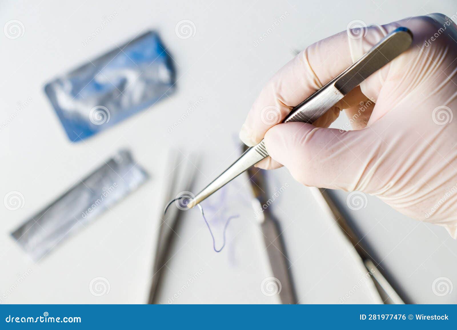 Doctor Holding a Suture with a Surgical Scalpel Stock Photo - Image of ...
