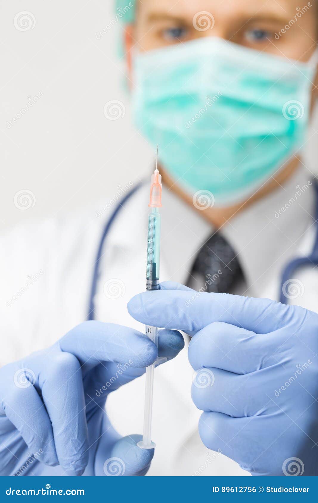 Doctor Holding Syringe with Two Hands and Getting Ready To Make ...