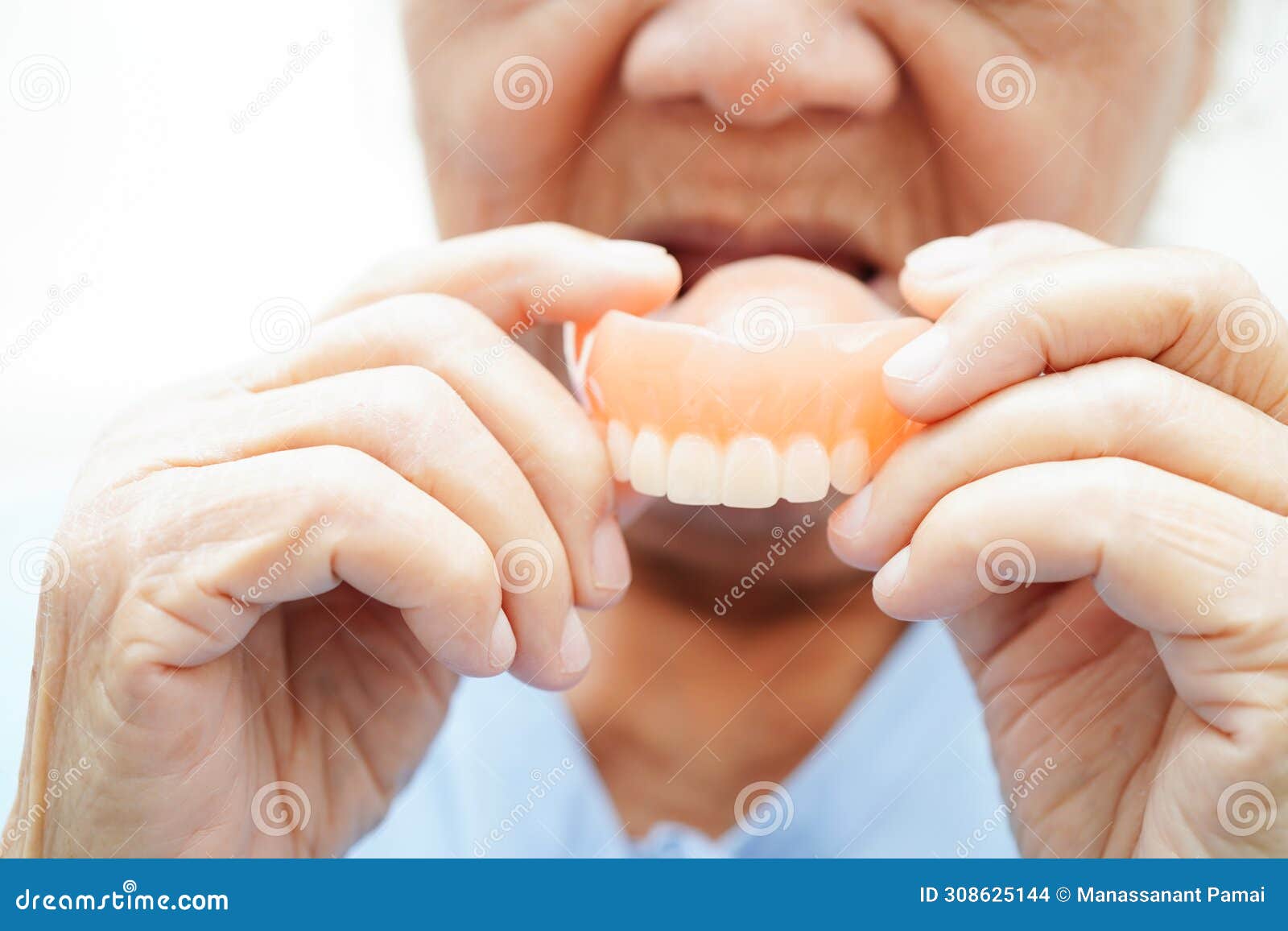 Doctor Holding Teeth Denture in Hand for Dentist Studying about ...