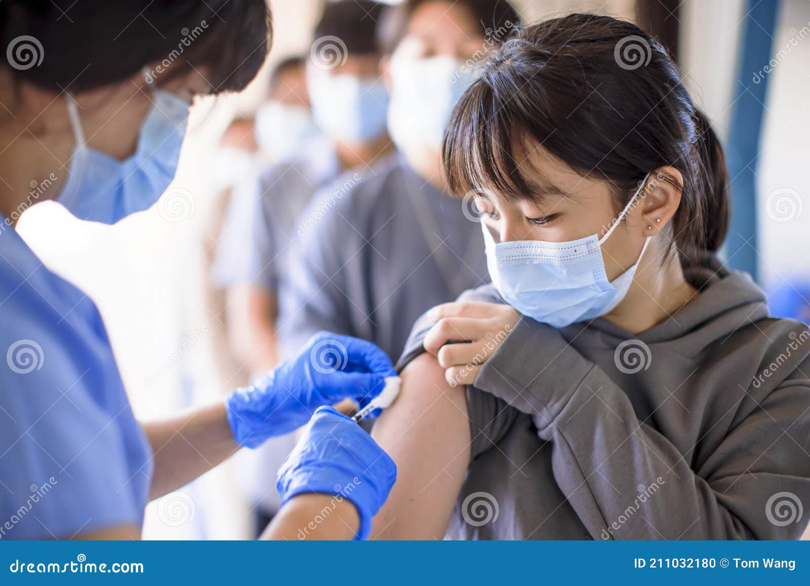 Doctor Injecting Patient With Intravenous Drugs Stock Photo ...
