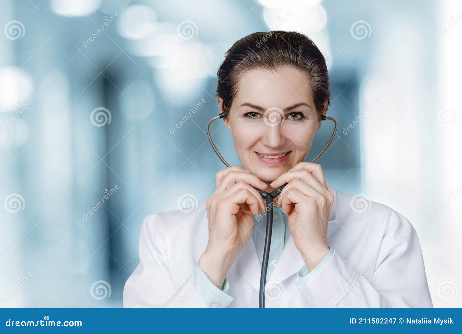 Doctor Inserts a Stethoscope into the Ears Stock Image - Image of ...