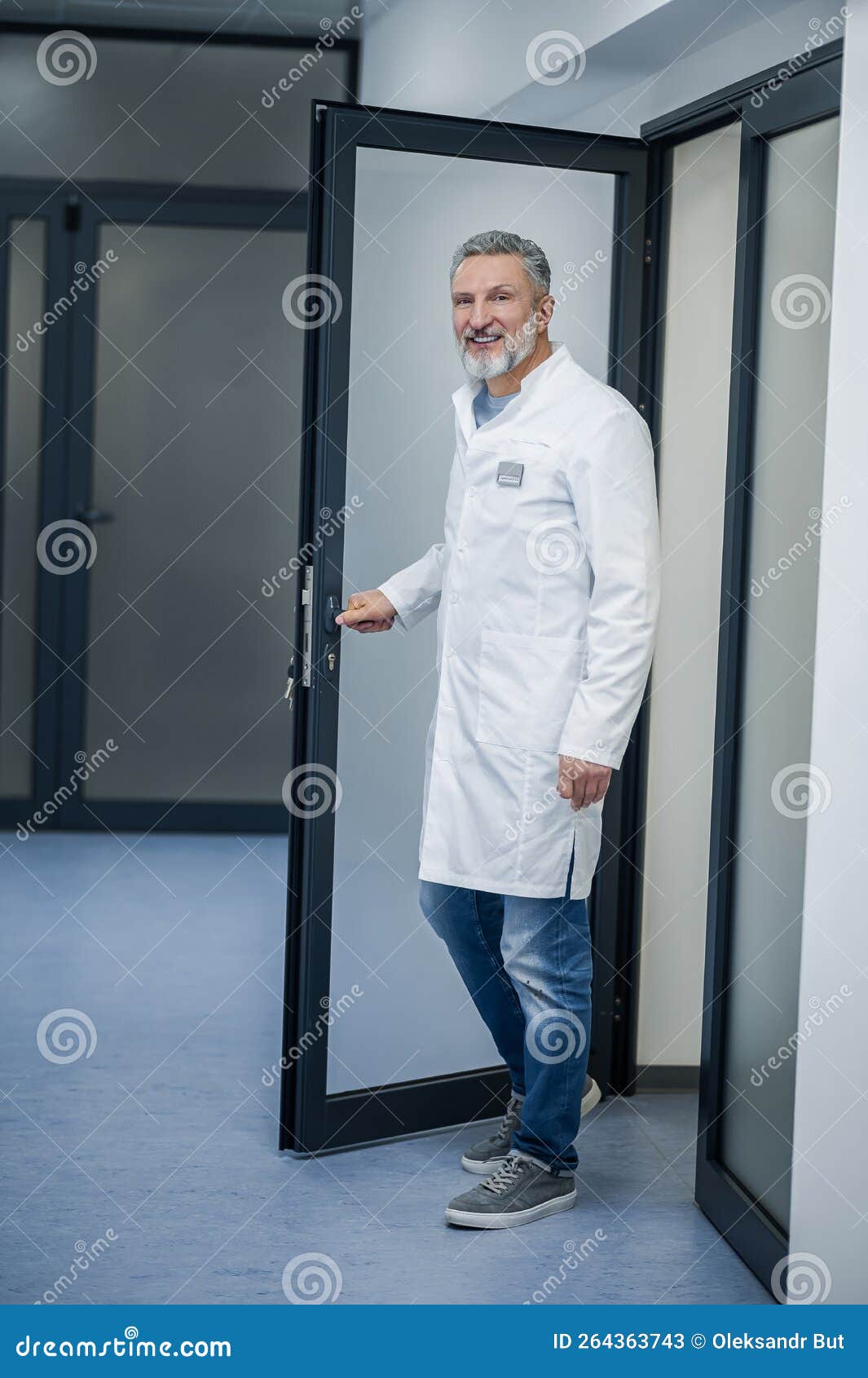 A Doctor in a Lab Coat Opening the Door of His Office Stock Image ...