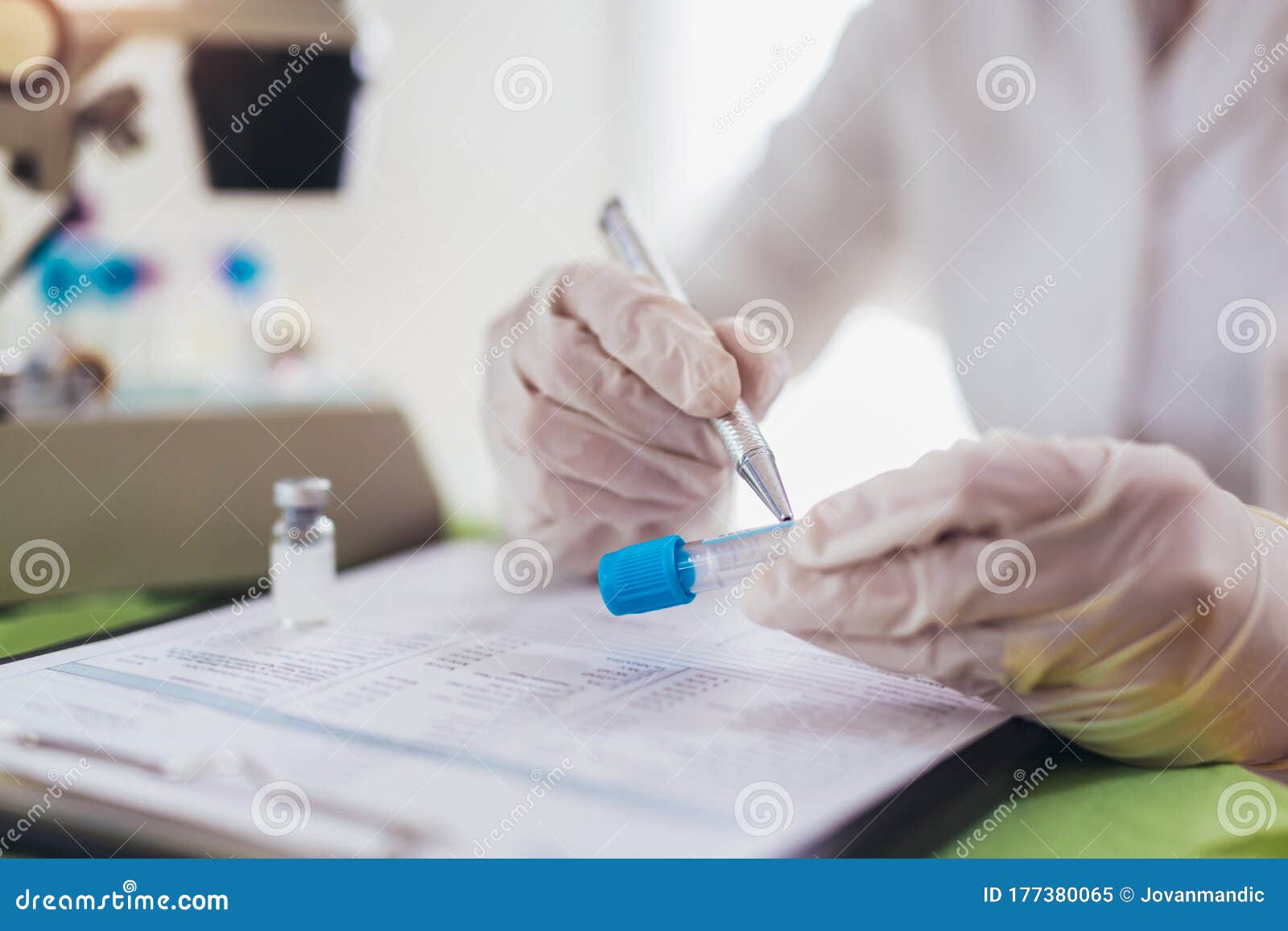 Doctor in the Laboratory with a Biological Tube for Analysis and ...