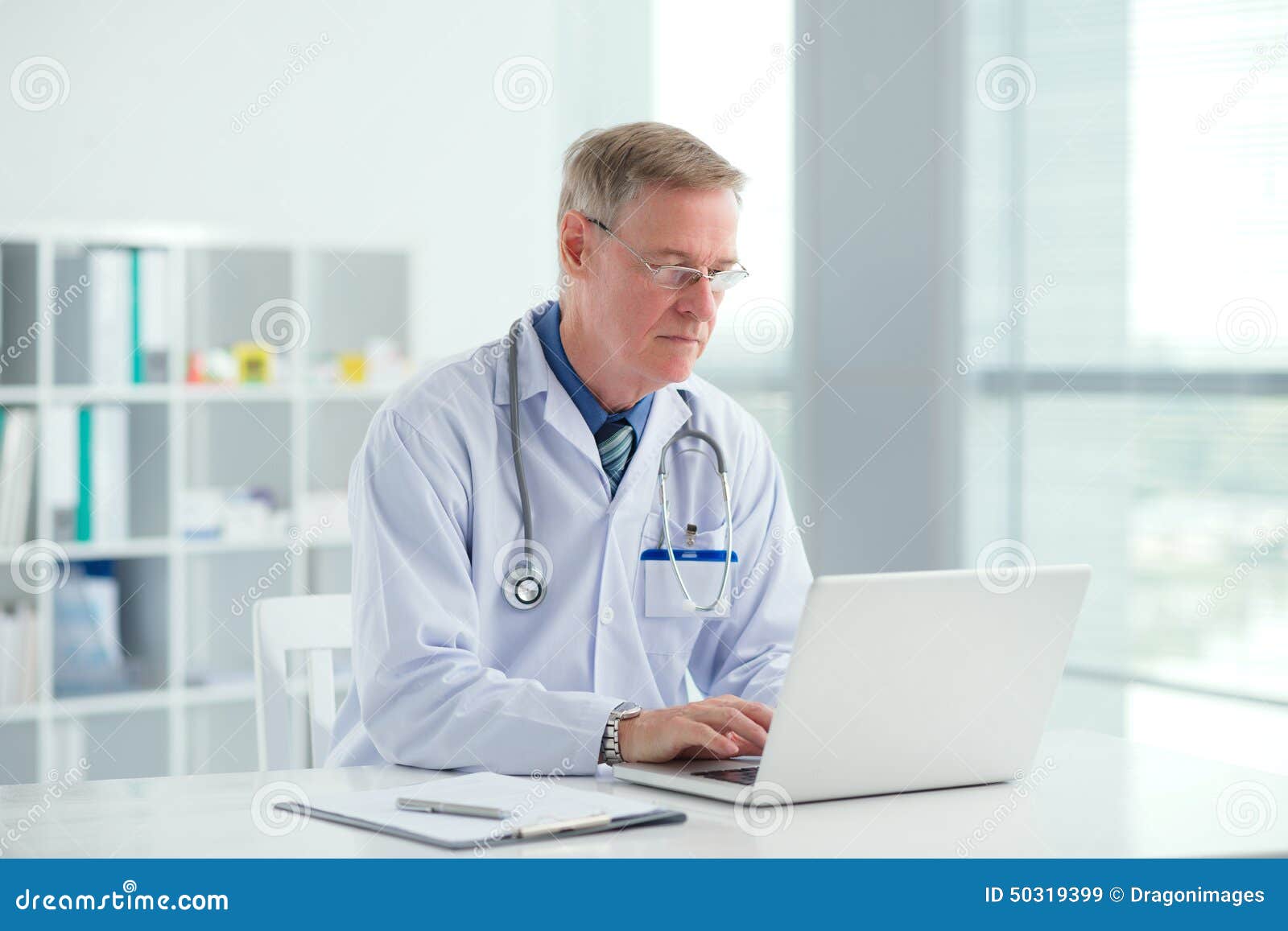 Doctor with laptop stock image. Image of glasses, physician - 50319399