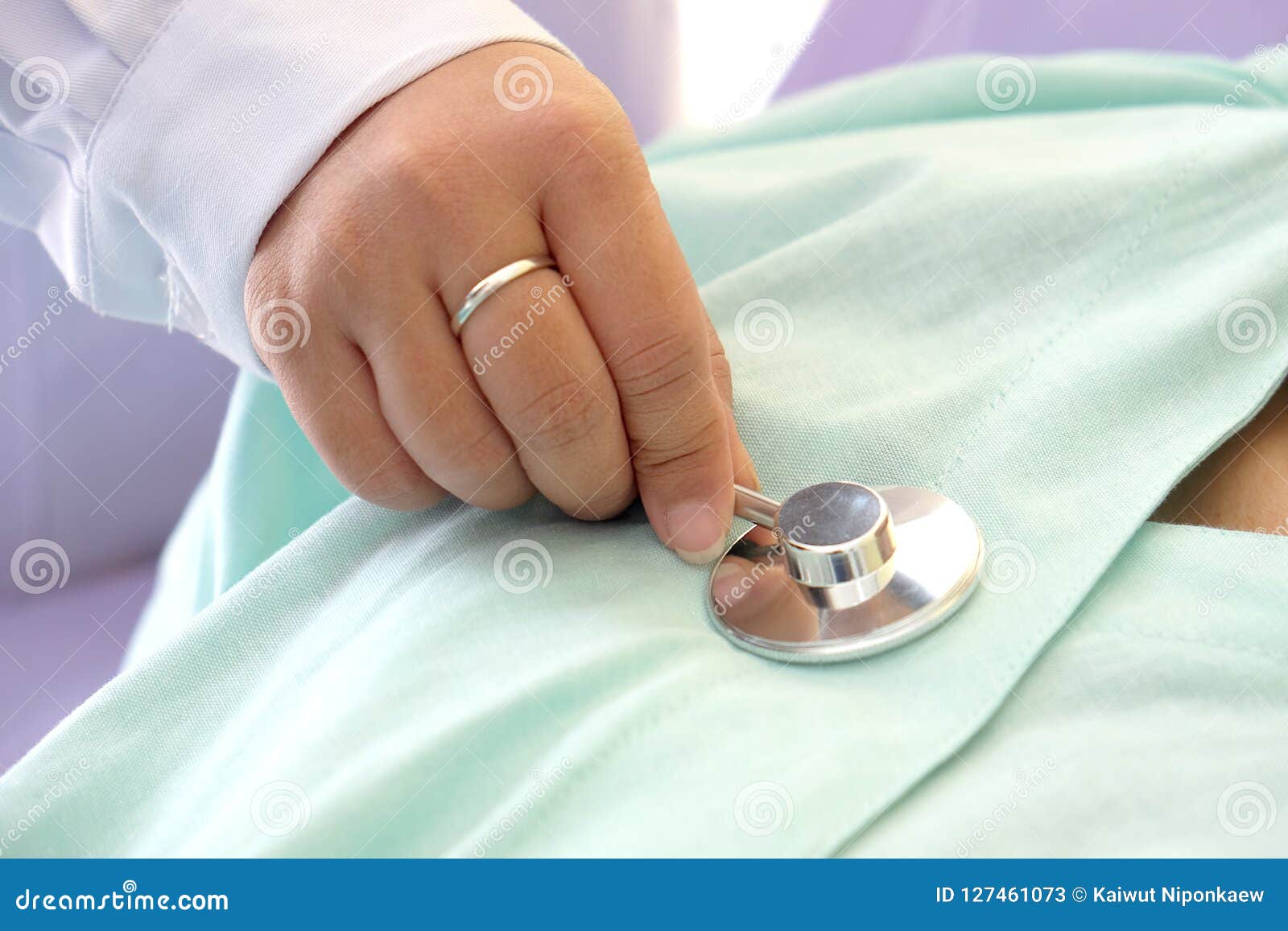 Doctor listening to heart stock image. Image of patients - 127461073