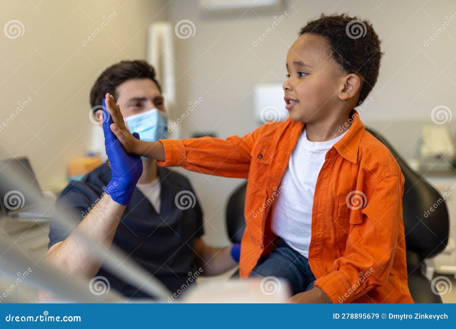 Doctor and Little Patient Doing High Five and Looking Contented Stock ...