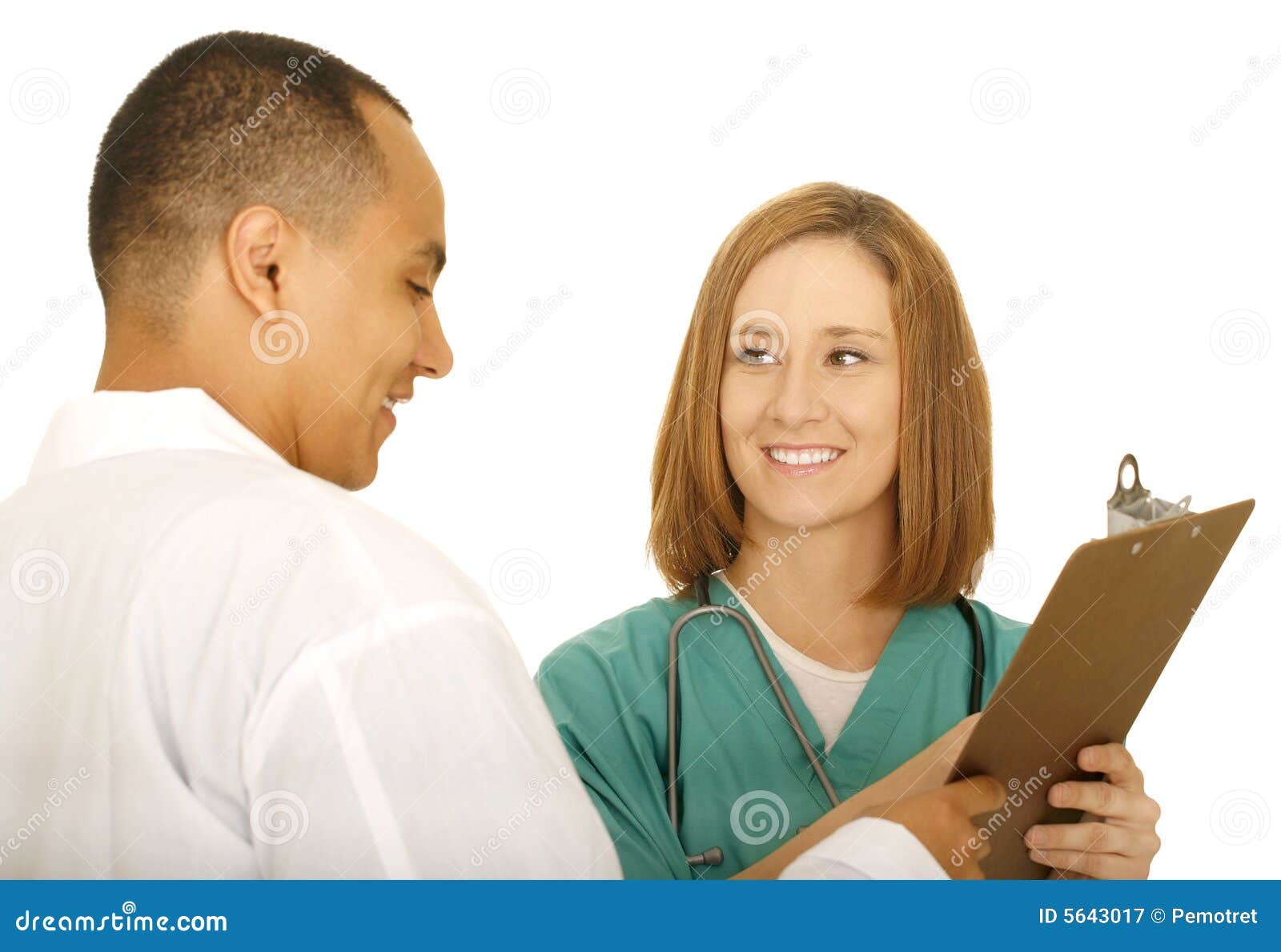 Doctor Looking at ClipBoard Stock Image - Image of male, pretty: 5643017