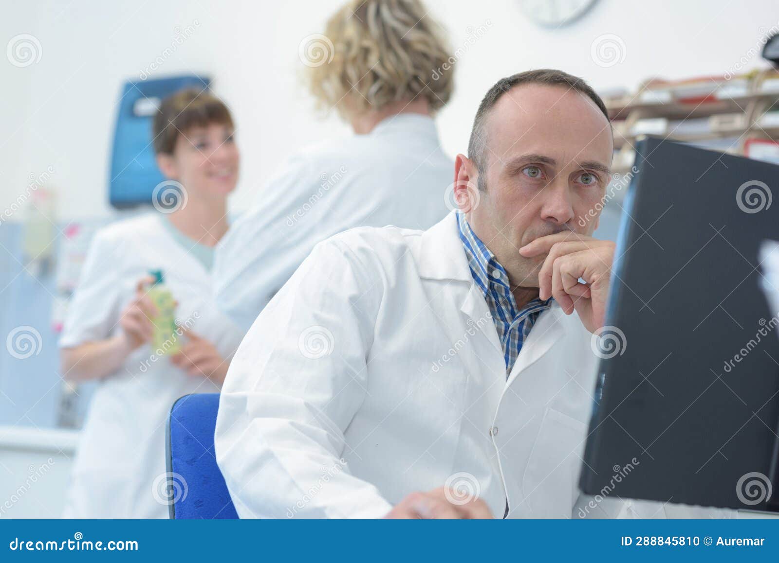 Doctor Looking at Computer Screen Stock Photo - Image of checking ...