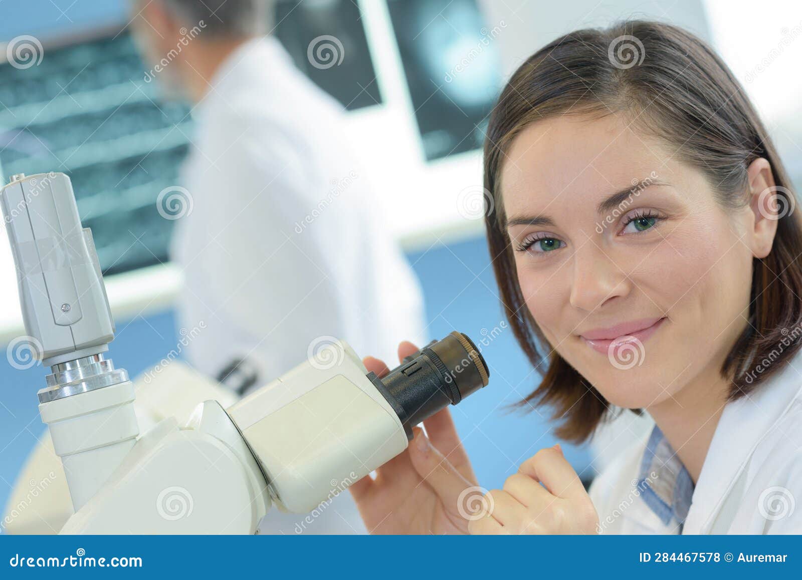 Doctor Looking through Microscope Stock Photo - Image of microscope ...