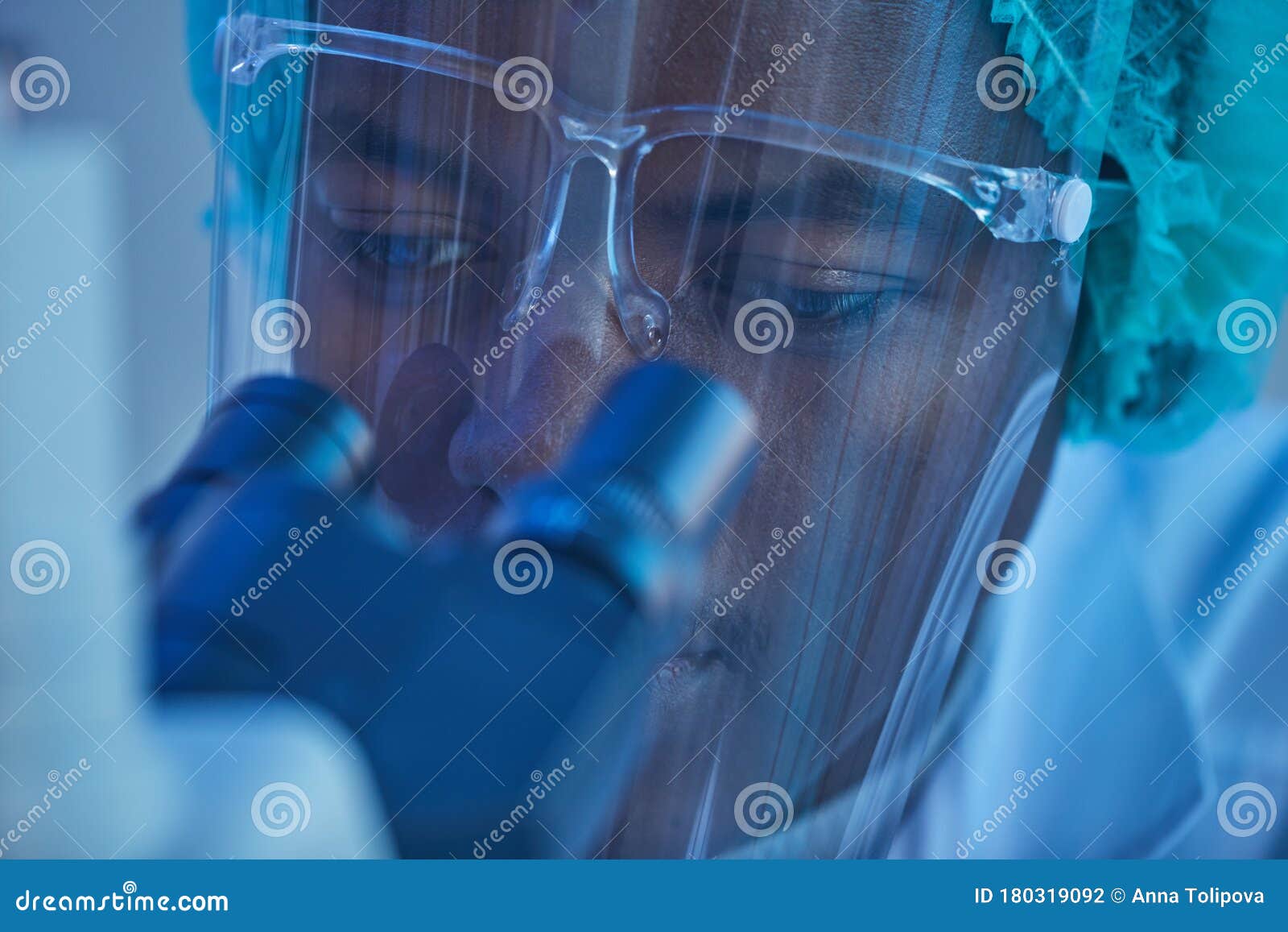 Doctor Looking through the Microscope Stock Photo - Image of science ...