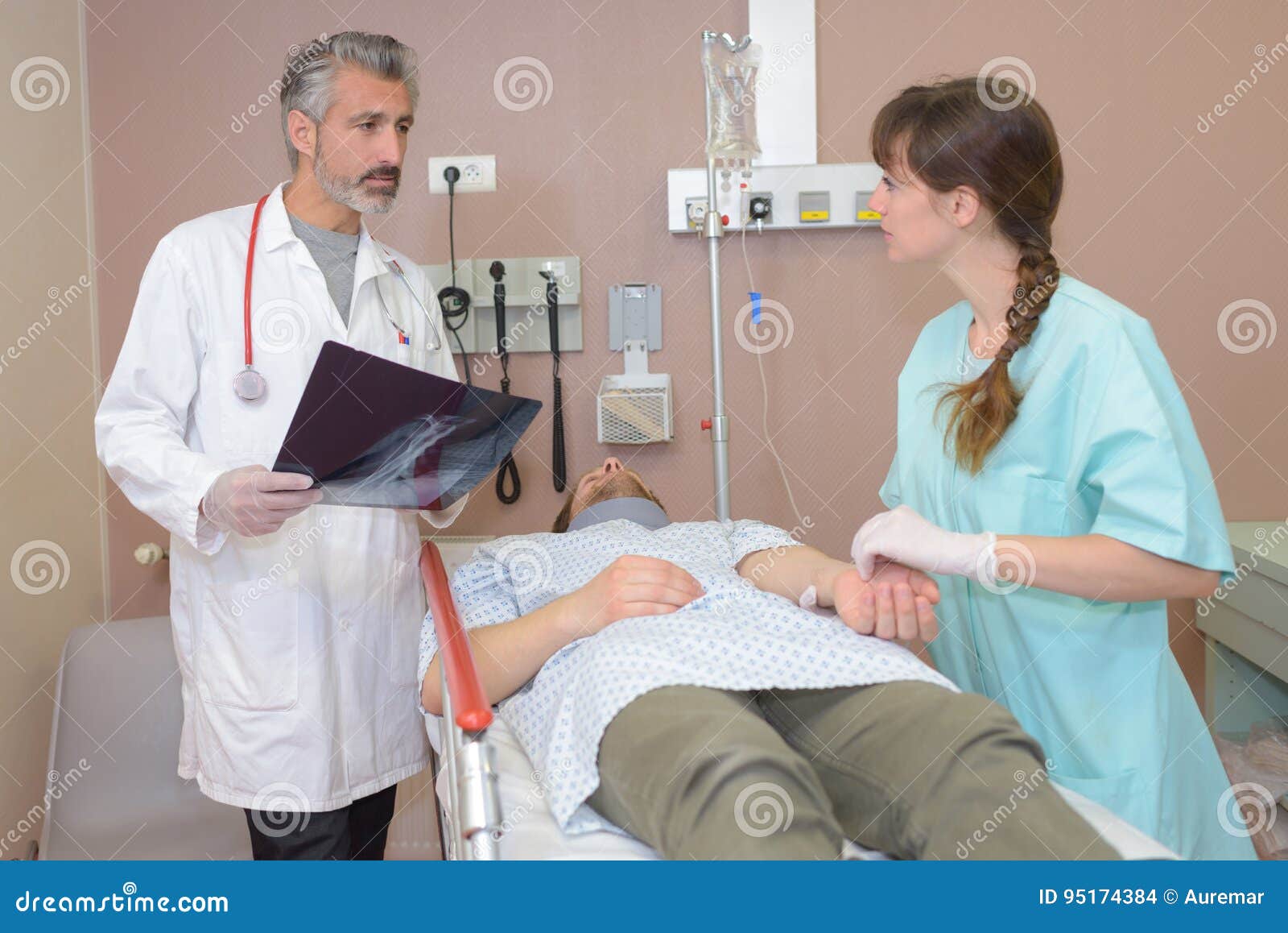 Doctor Looking after Patient with Nurse Stock Photo - Image of ...