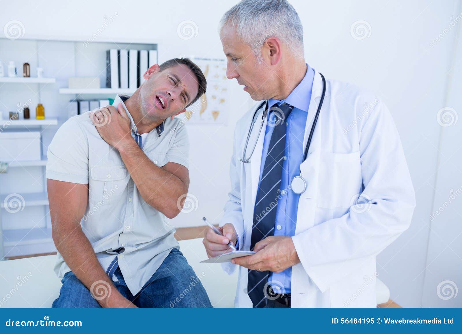 Doctor Looking at Patient Shoulder Stock Image - Image of pain, male ...
