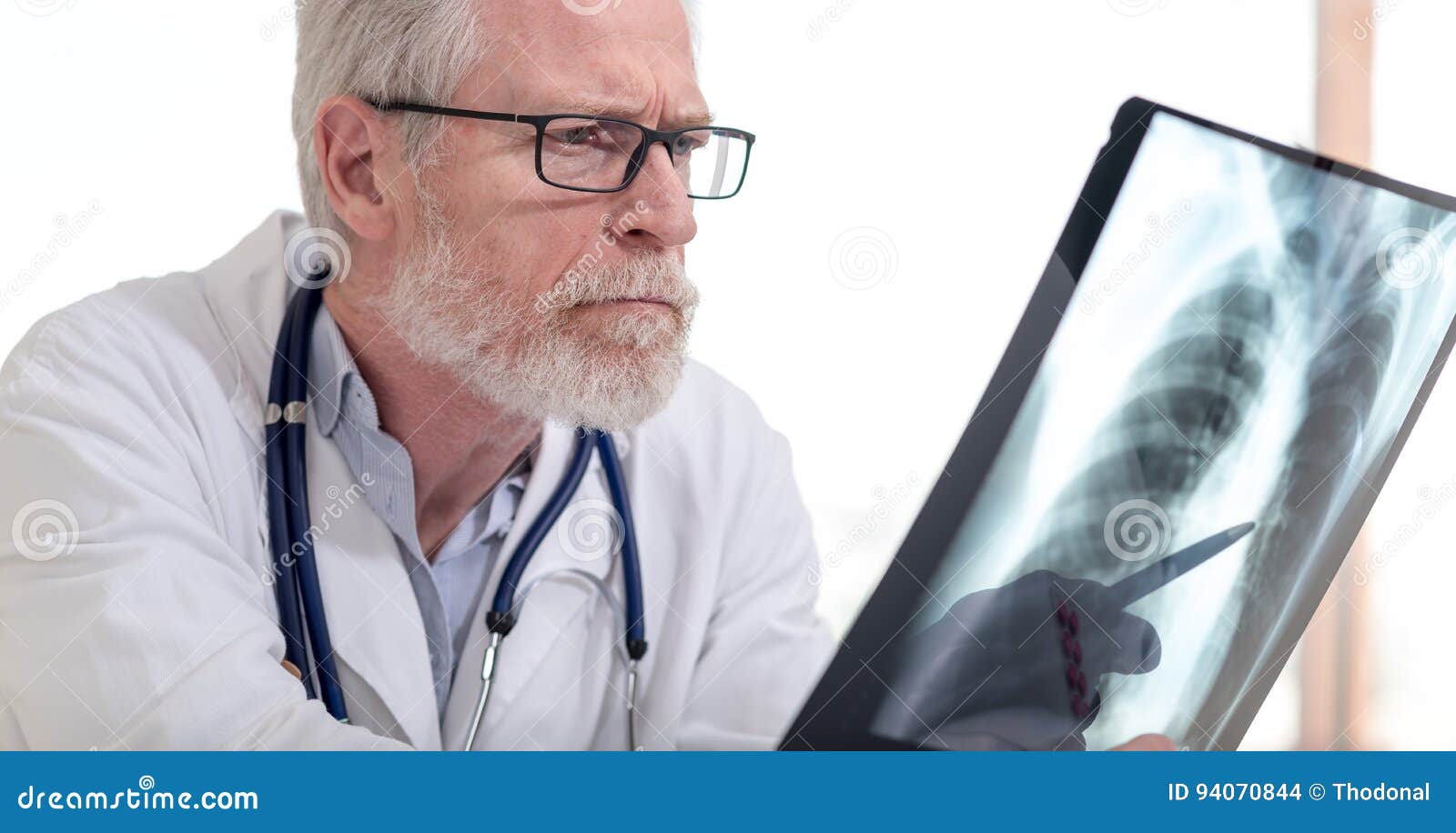 Doctor looking at x-ray stock photo. Image of doctor - 94070844