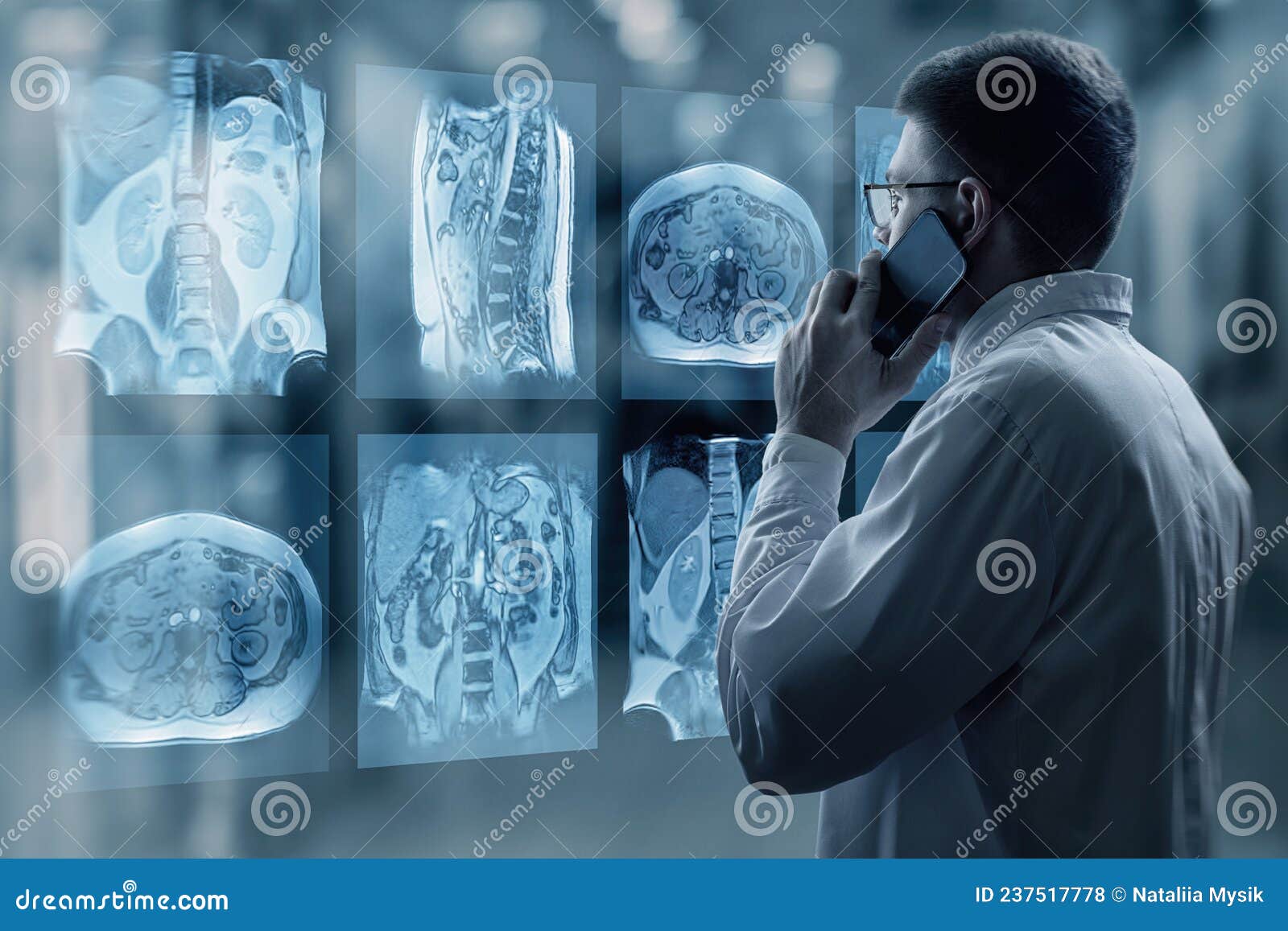 Doctor Looking at X-rays on a Virtual Computer Screen Stock ...
