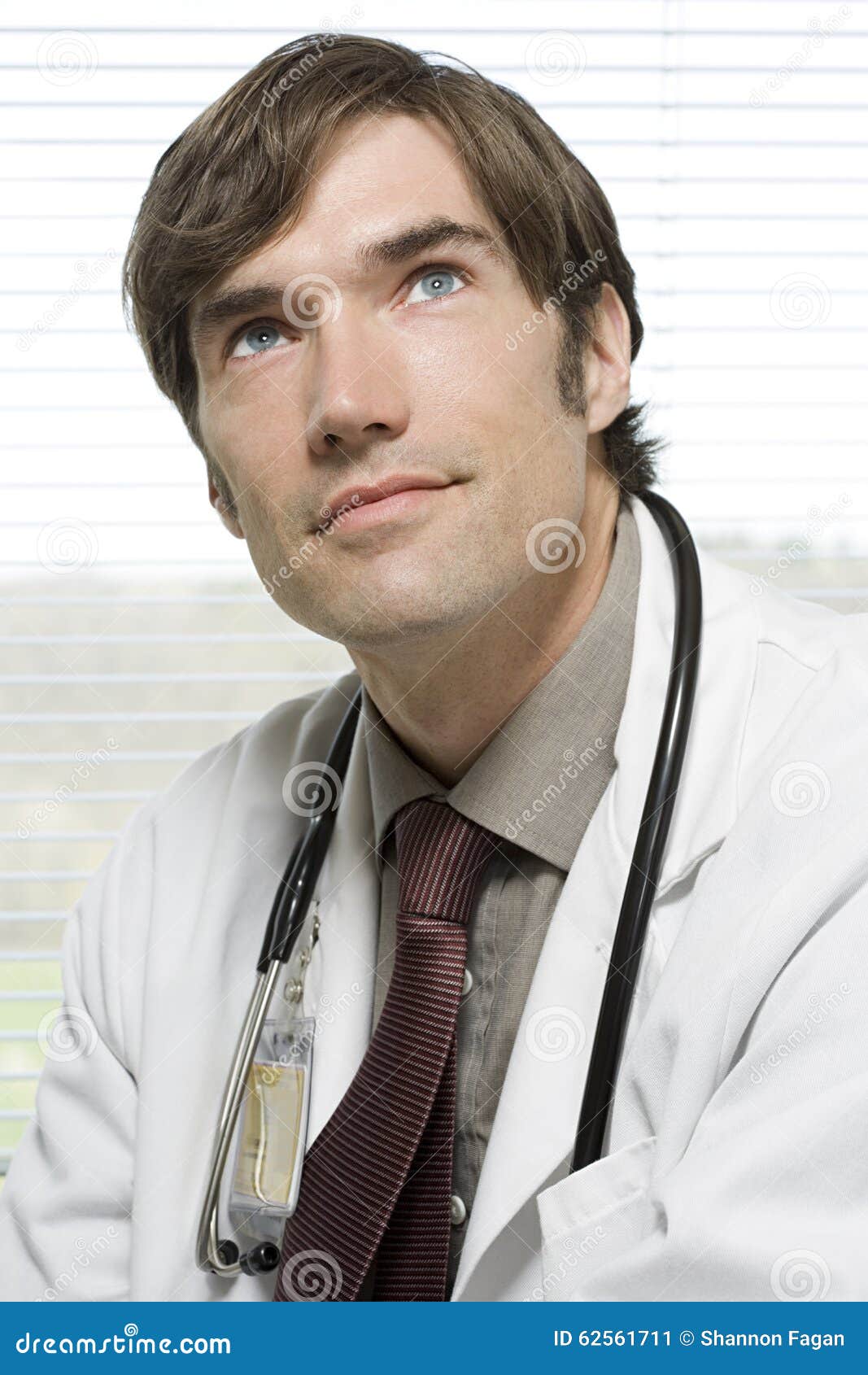 Doctor looking up stock image. Image of front, healthcare - 62561711