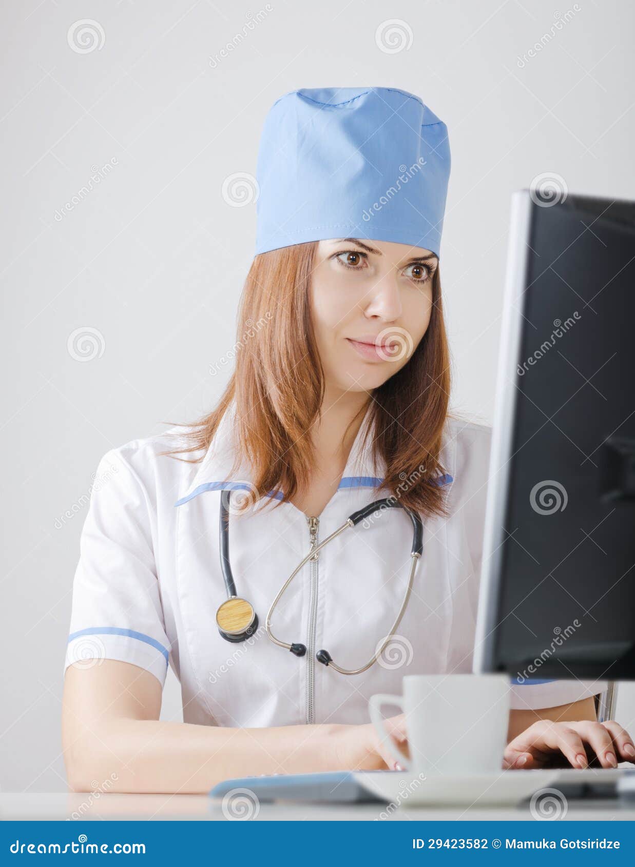 Doctor Looks at a Computer Monitor Stock Photo - Image of doctor ...