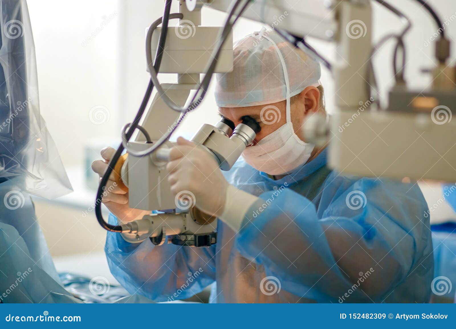 The Doctor Looks through a Microscope, the Aphtholmologist Performs an ...