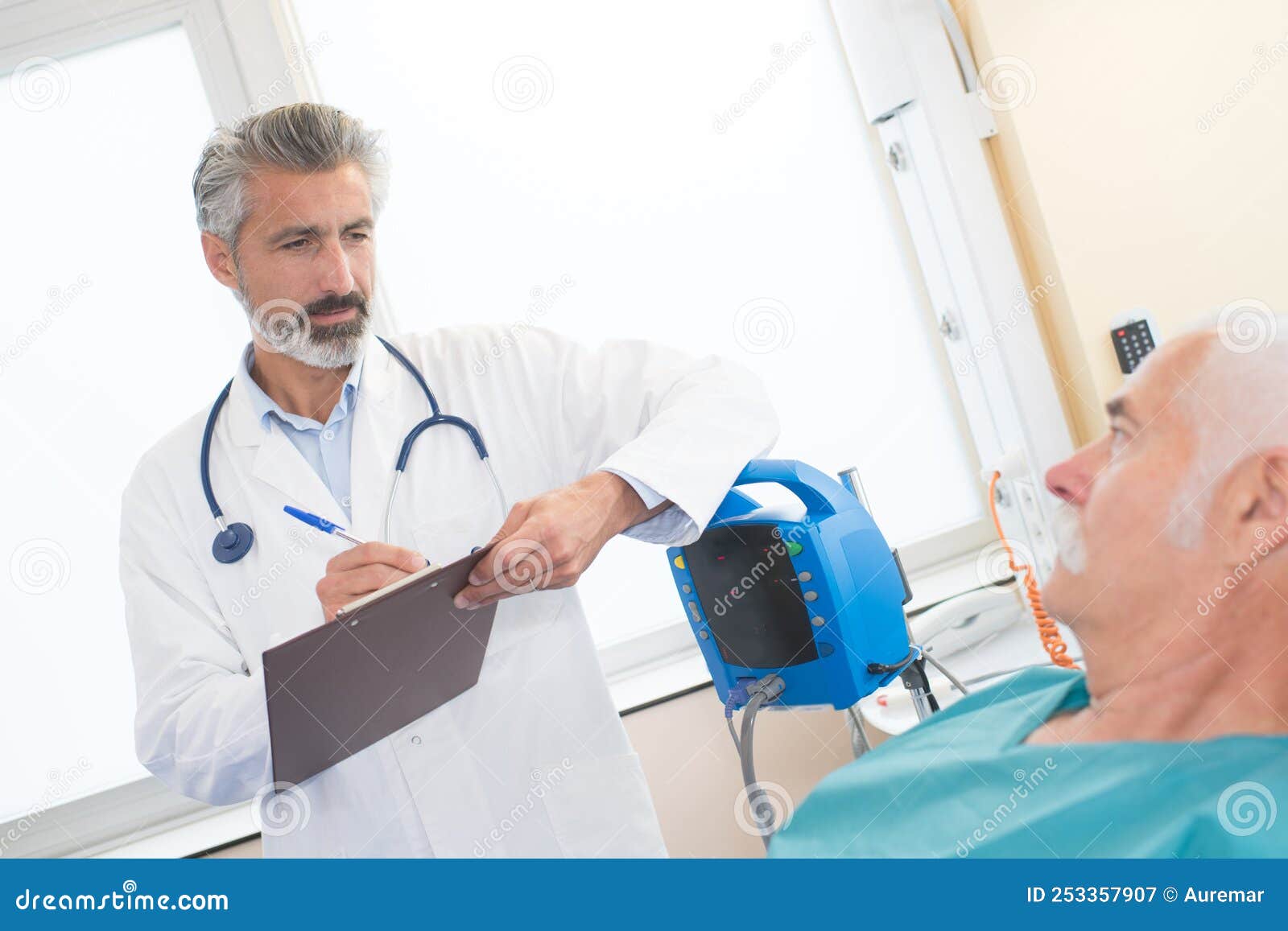 Doctor Making Anamnesis with Senior Patient Lying Stock Image - Image ...