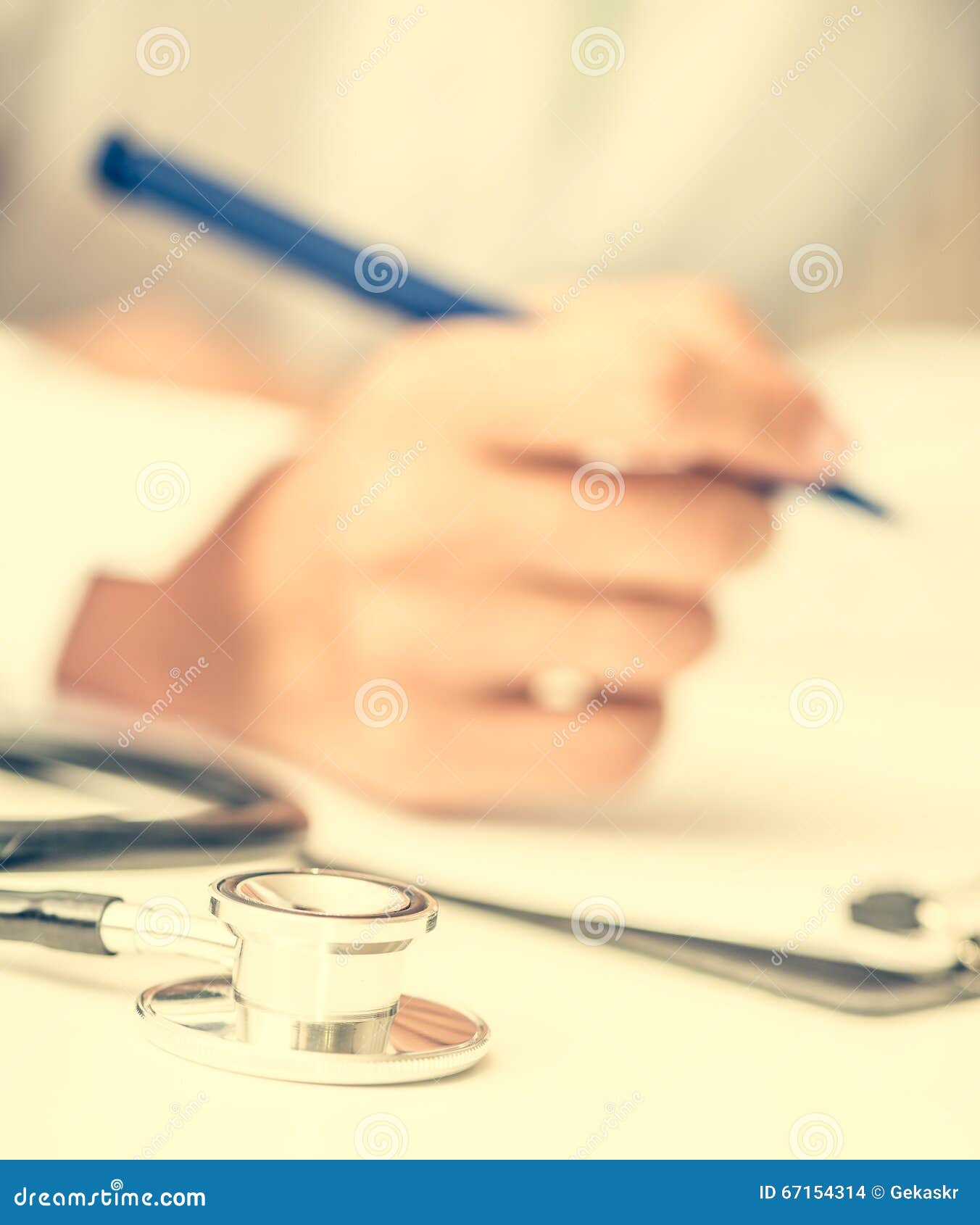Doctor making notes stock photo. Image of tool, holding - 67154314