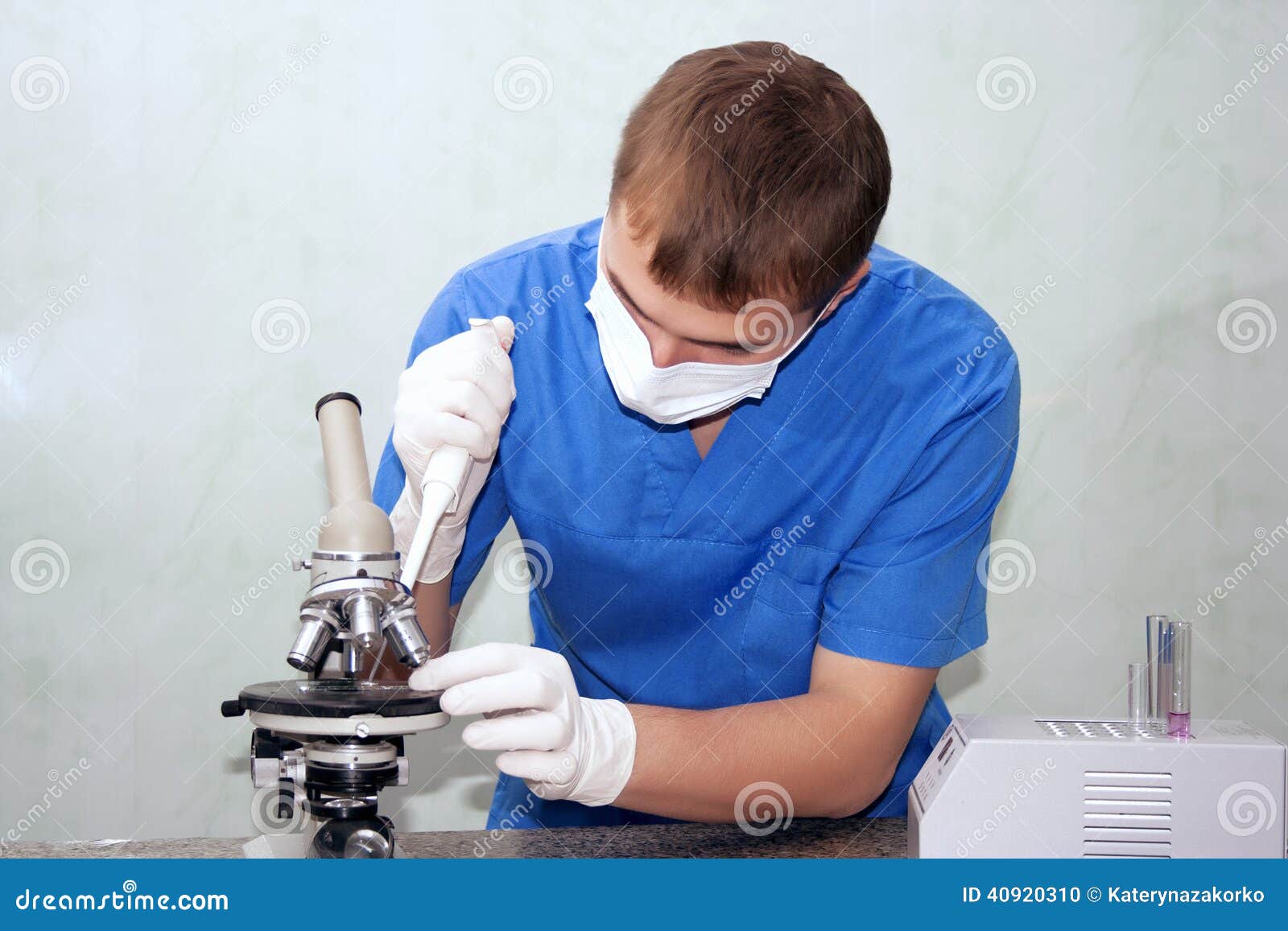 Doctor Making Test with Microscope Stock Photo - Image of blue, table ...