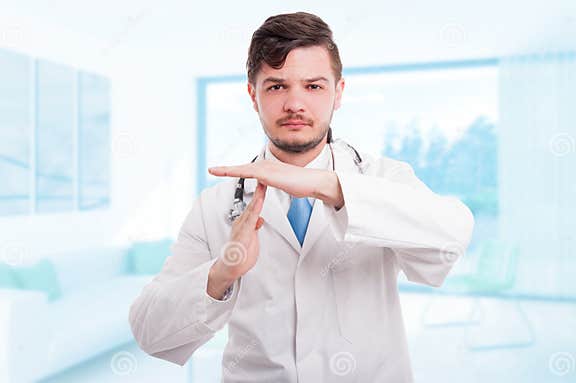 Doctor Making Time Out Sign Stock Photo - Image of physician, clinic ...