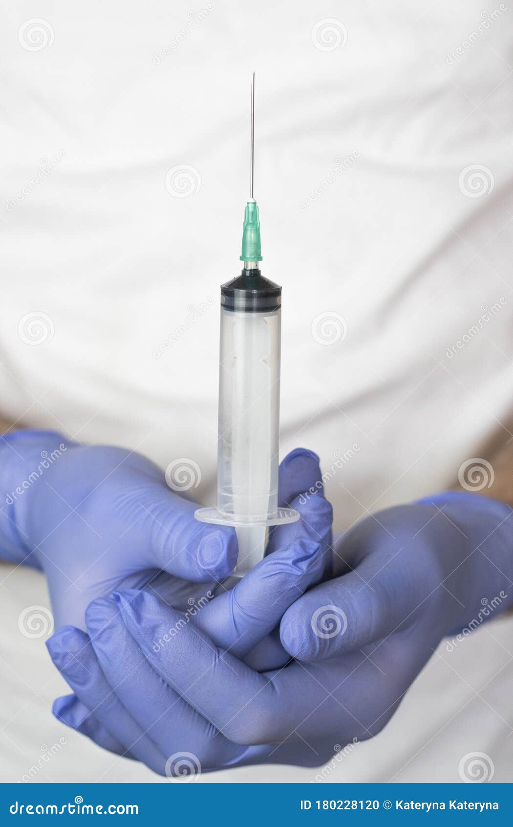 Doctor In Blue Medical Gloves Holding Syringe With Needle Closeup Stock