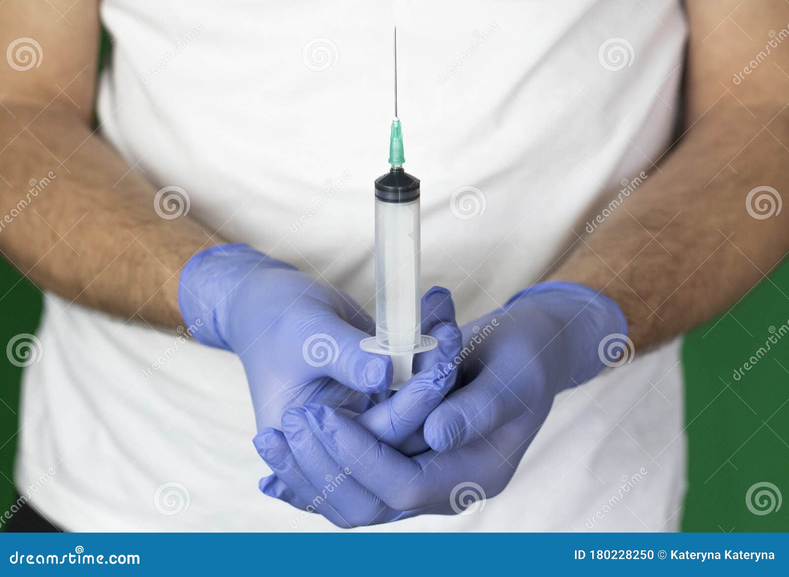 Doctor In Blue Medical Gloves Holding Syringe With Needle Closeup Stock
