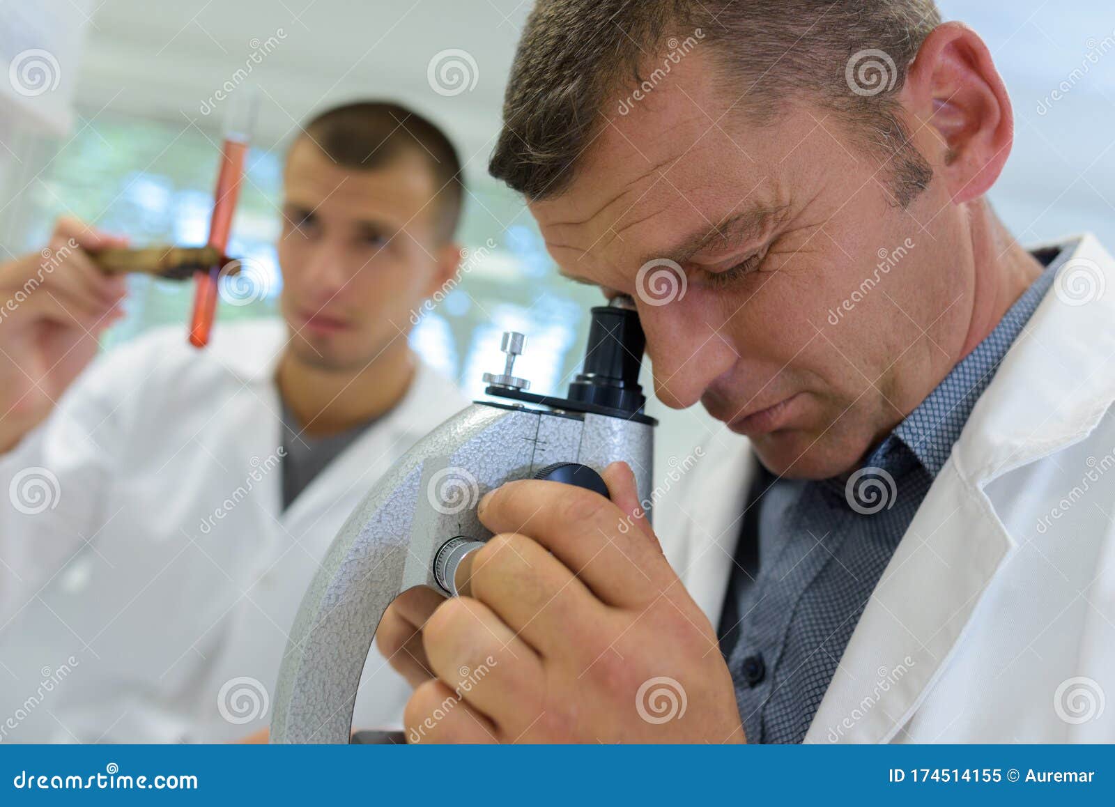 Doctor man with microscope stock image. Image of examine - 174514155