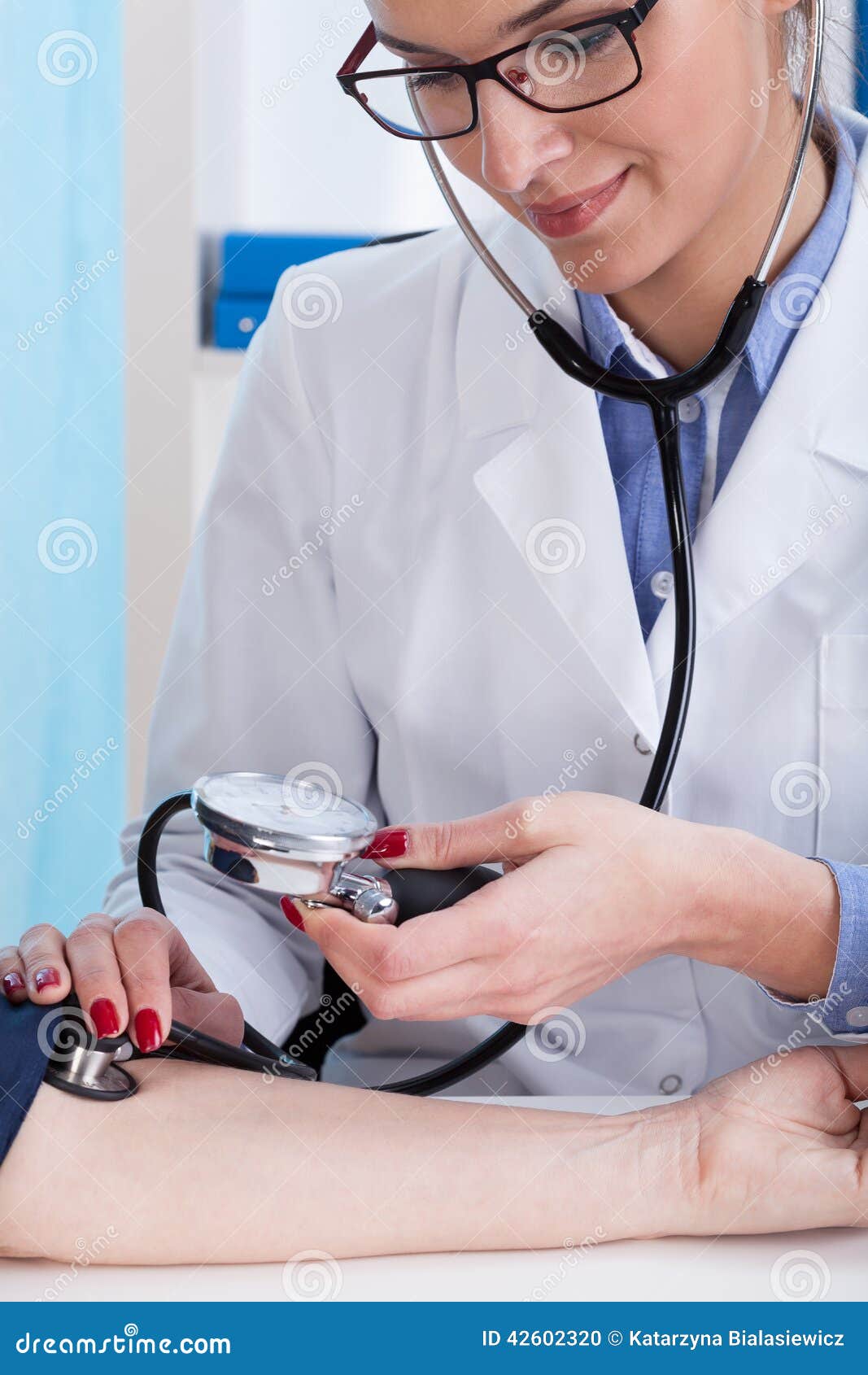 The Doctor Measures the Pressure of a Patient Stock Photo - Image of ...