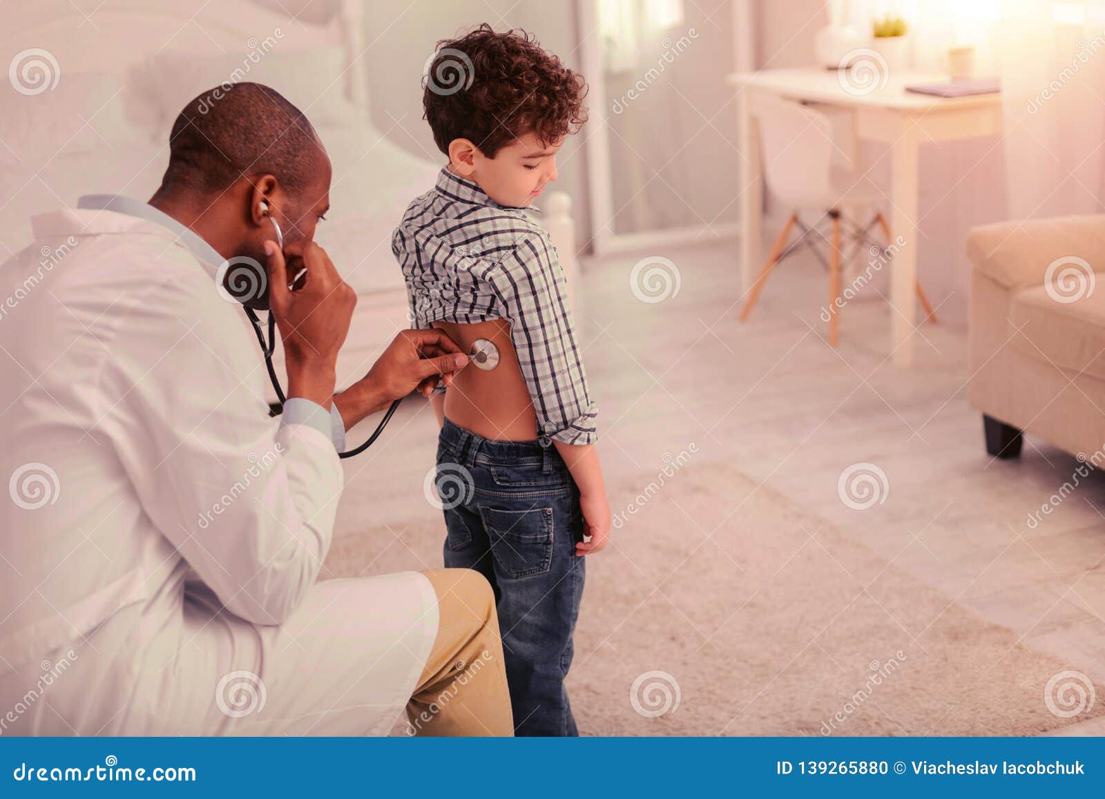 Doctor Meticulously Examining Child Having Breathing Problems Stock ...