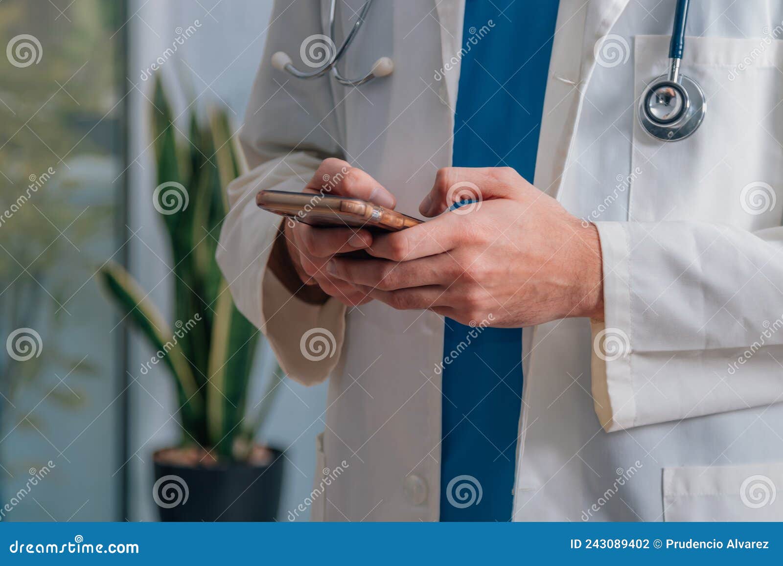 Doctor with mobile phone stock photo. Image of modern - 243089402