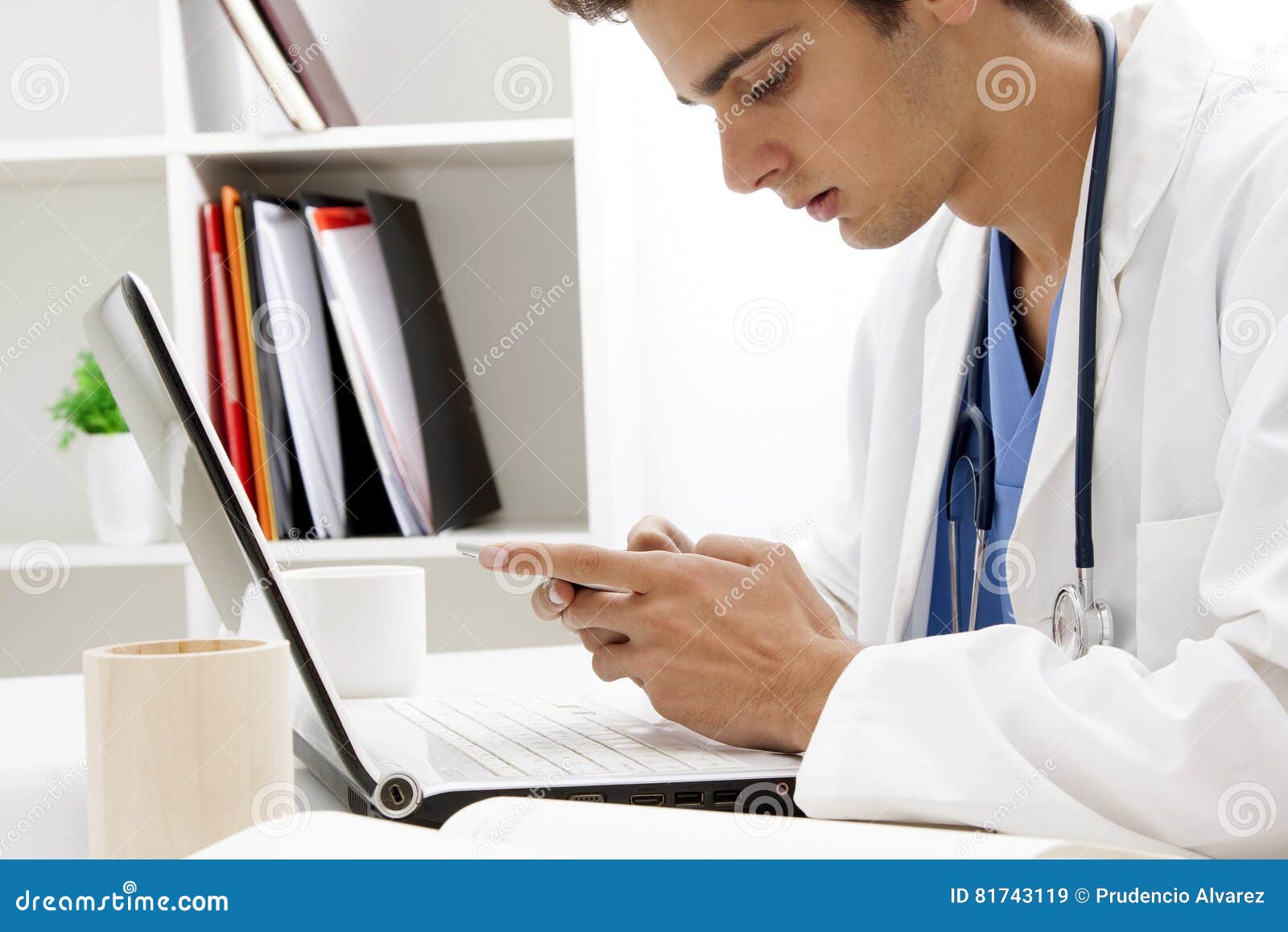 Doctor with mobile phone stock image. Image of internet - 81743119