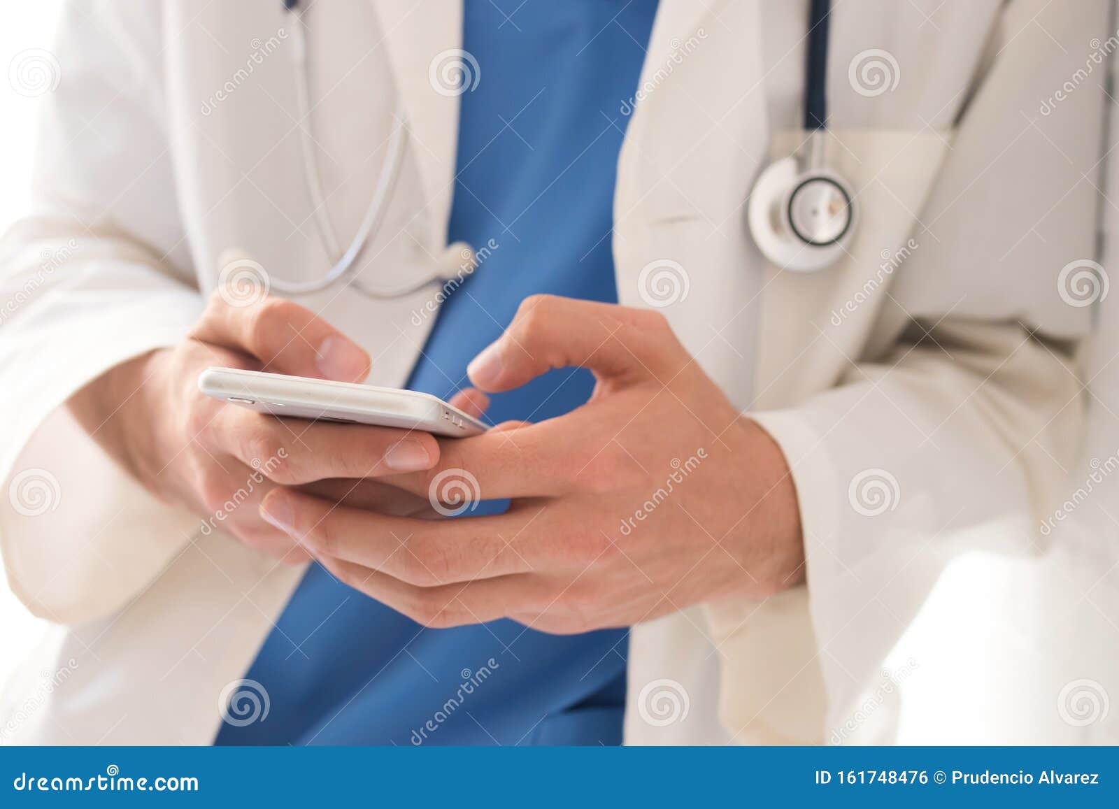 Doctor with mobile phone stock photo. Image of care - 161748476