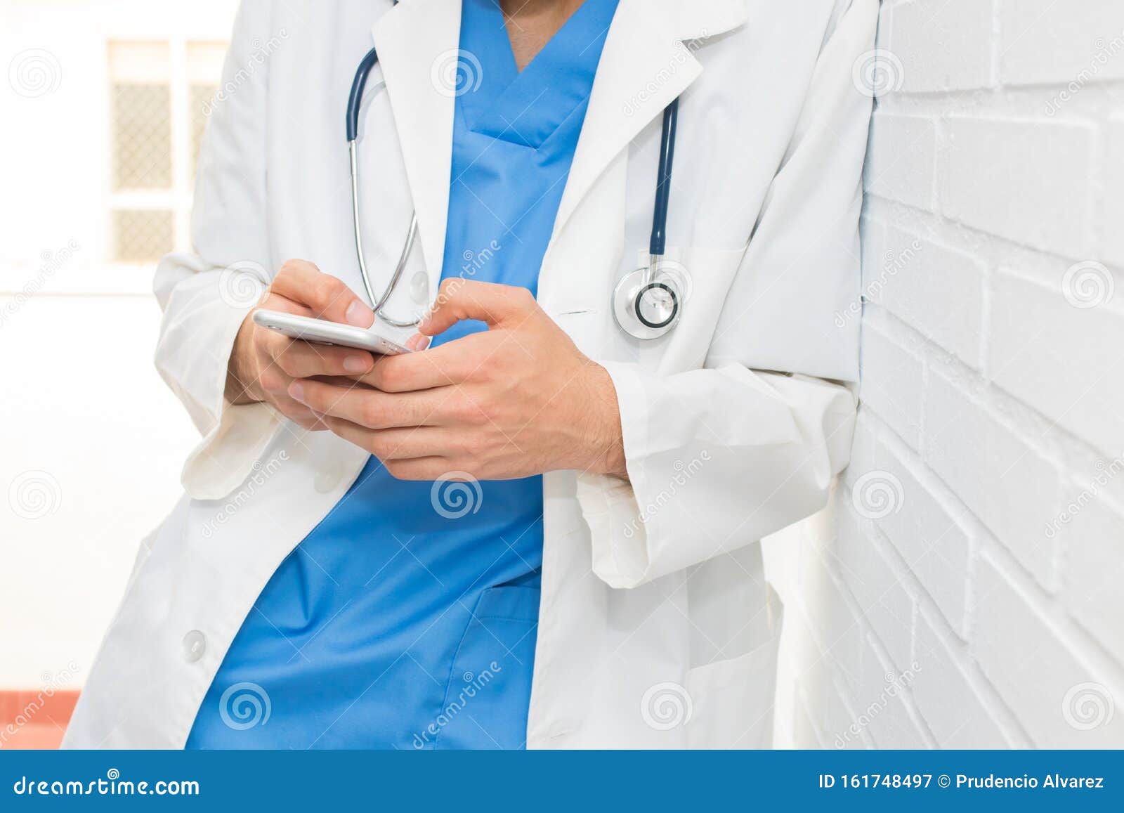 Doctor with mobile phone stock image. Image of cellphone - 161748497