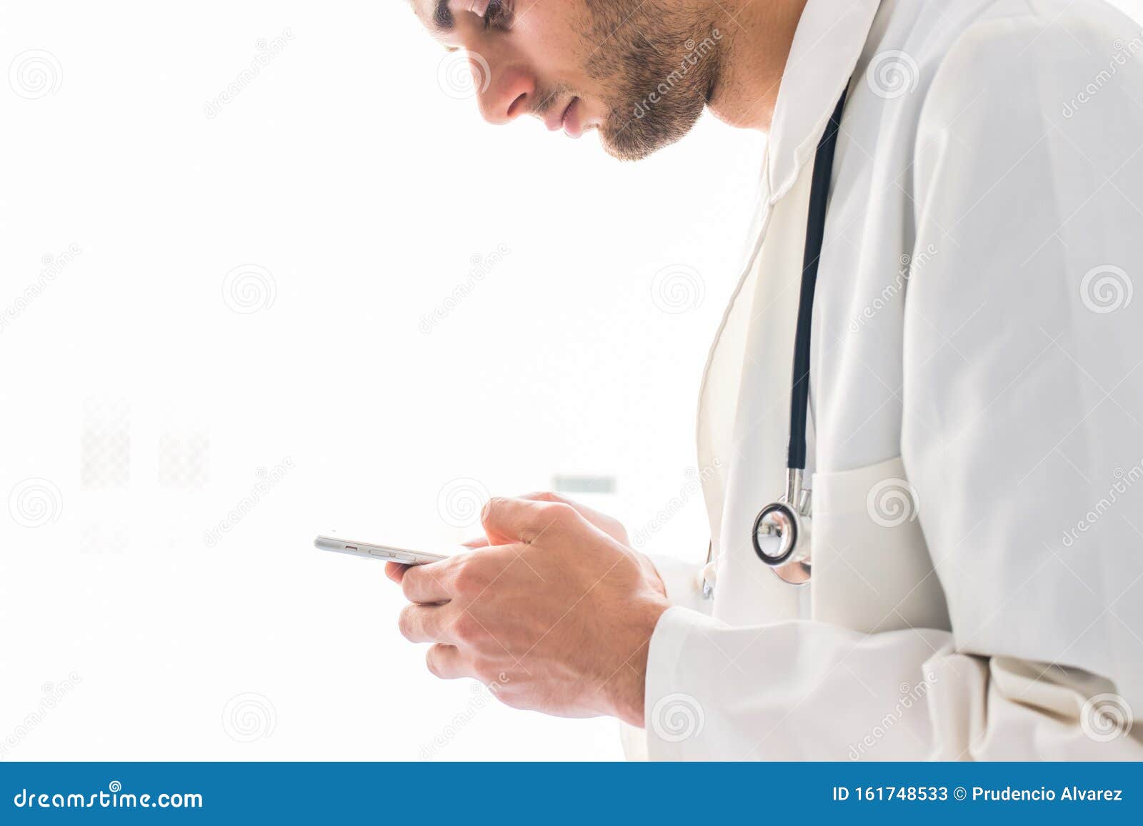 Doctor with mobile phone stock image. Image of office - 161748533