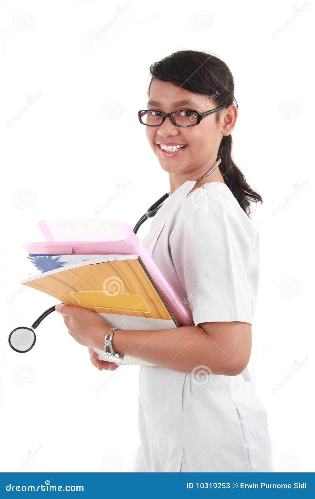 Graduated Nurse In Blue Uniform In Graduation Cap Standing, Looking ...