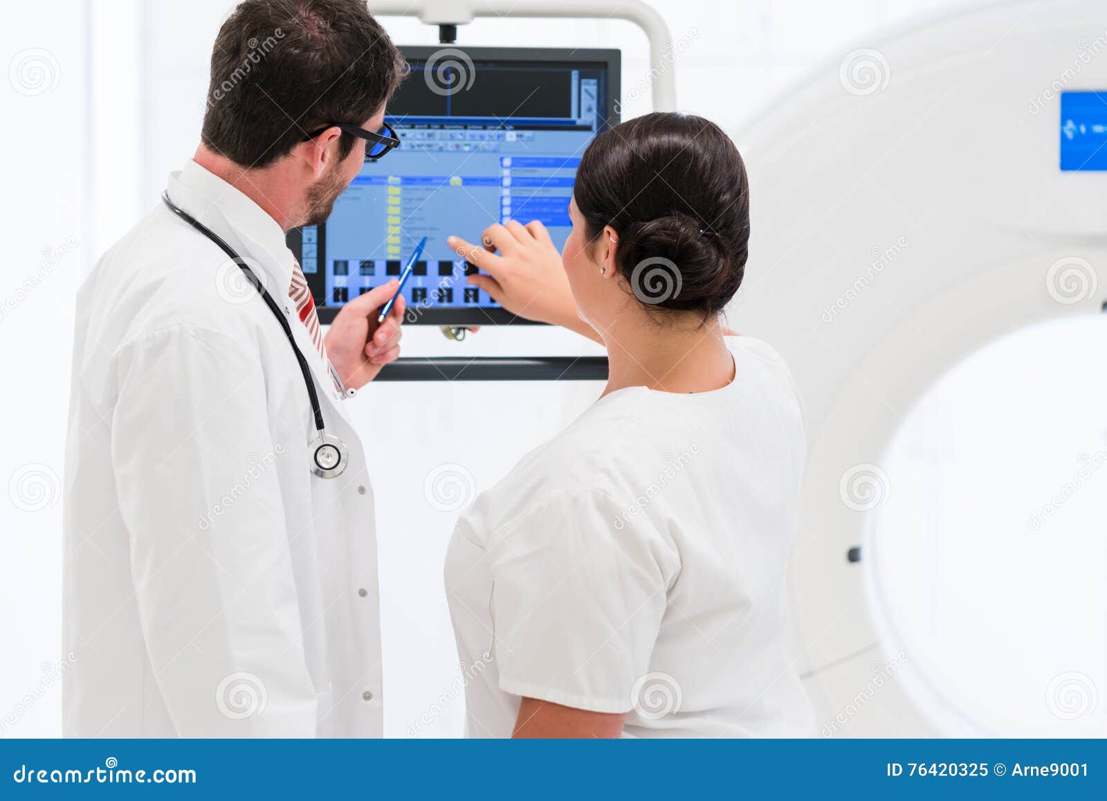 Doctor and Nurse Analyzing Data of CT Scan Stock Image - Image of ...