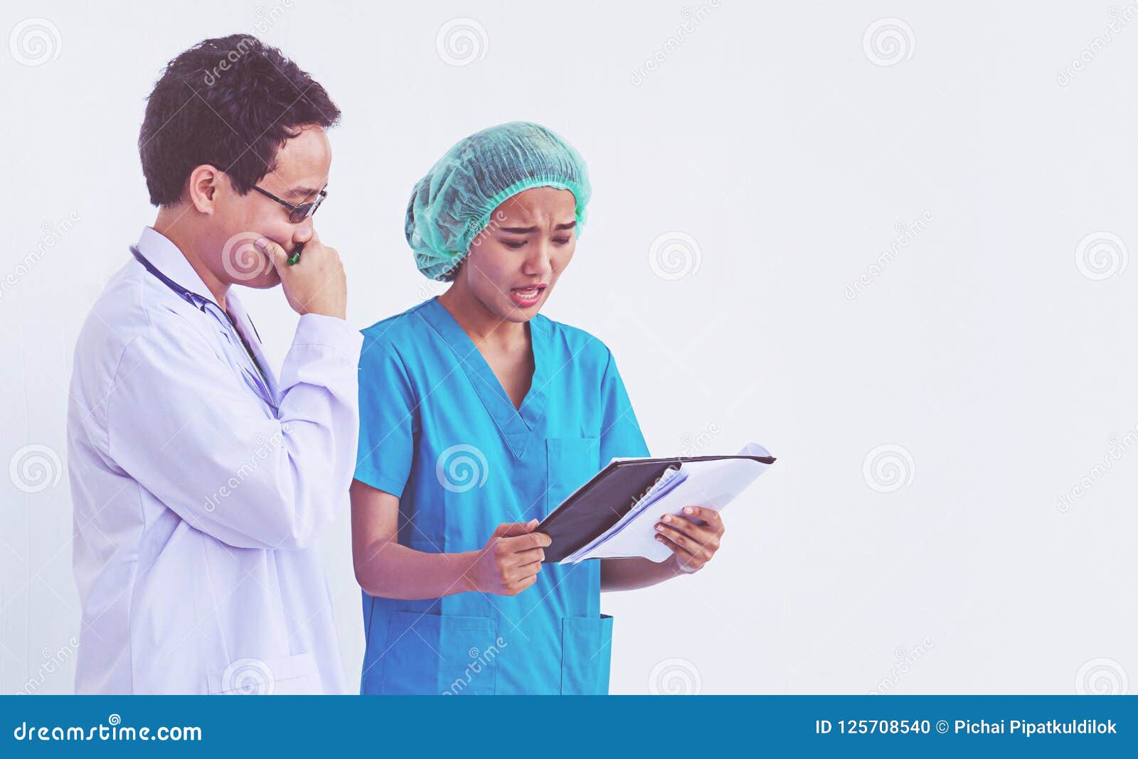Doctor and Nurse Checking Patient Information Stock Photo - Image of ...