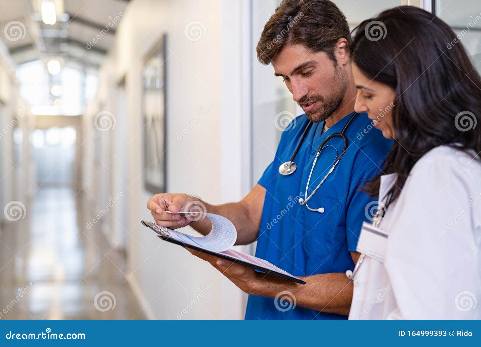 Doctor and Nurse Discussing Medical Report at Clinic Stock Image ... Doctor and Nurse Discussing Medical Report at Clinic Stock Image ...
