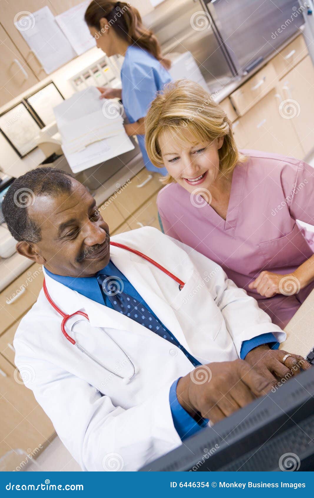 A Doctor and Nurse Discussing Something Stock Photo - Image of indoors ...
