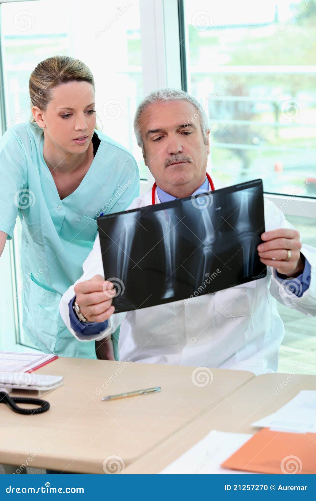 Doctor and Nurse Examining an Xray Stock Photo - Image of people ...