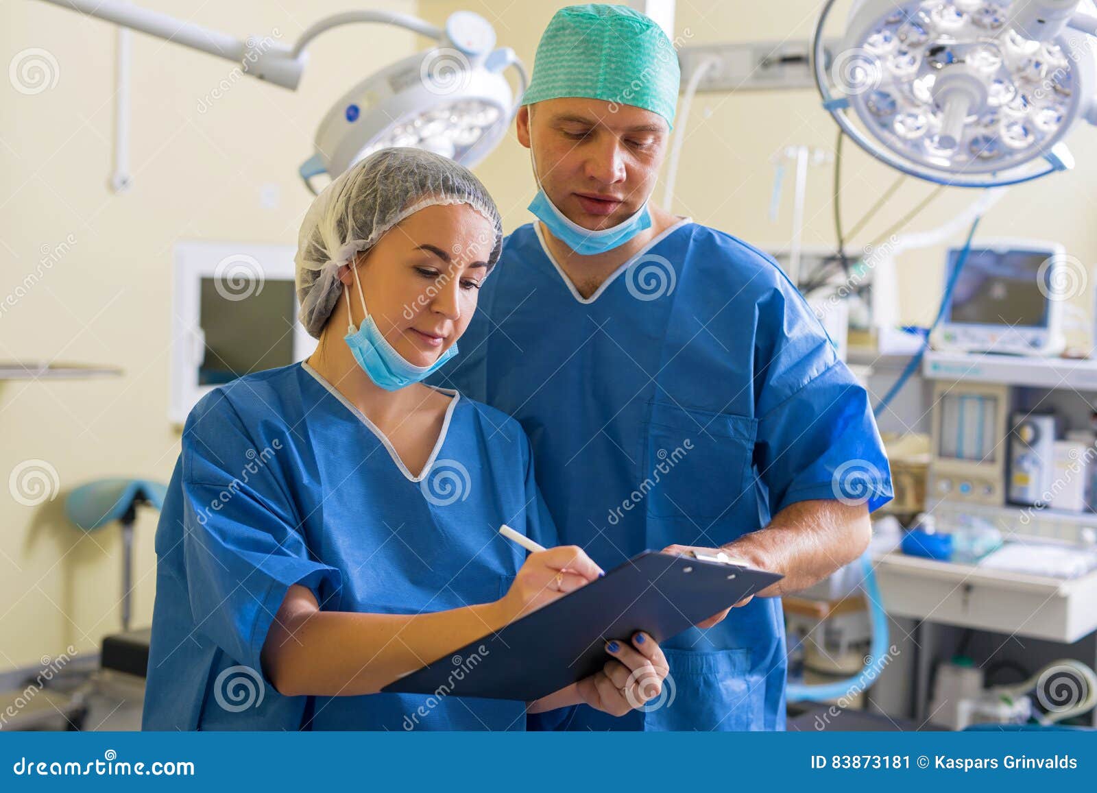 Doctor and Nurse Going through the Paperwork Stock Image - Image of ...