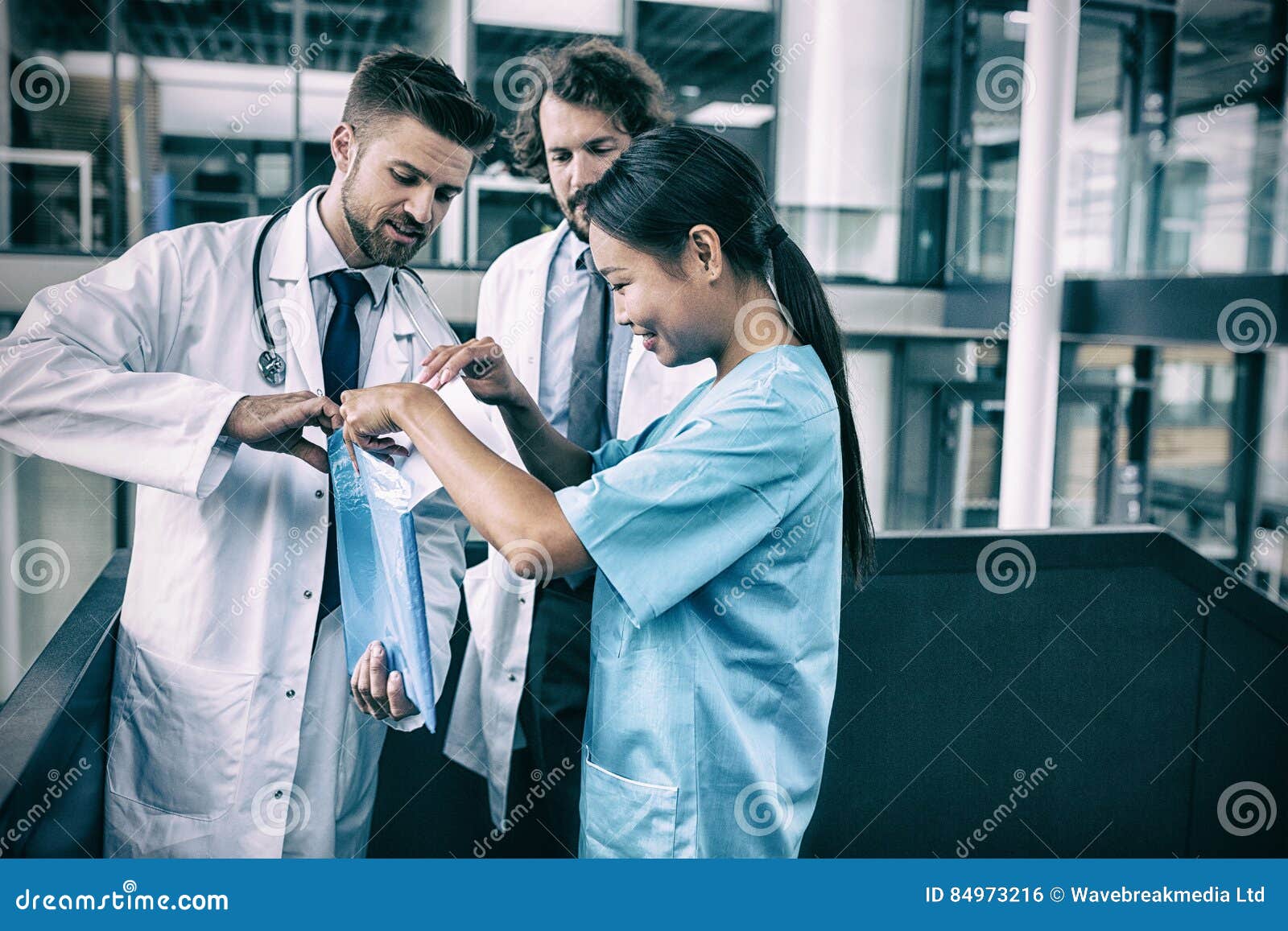 Doctor and Nurse Opening a File Folder Stock Photo - Image of ...