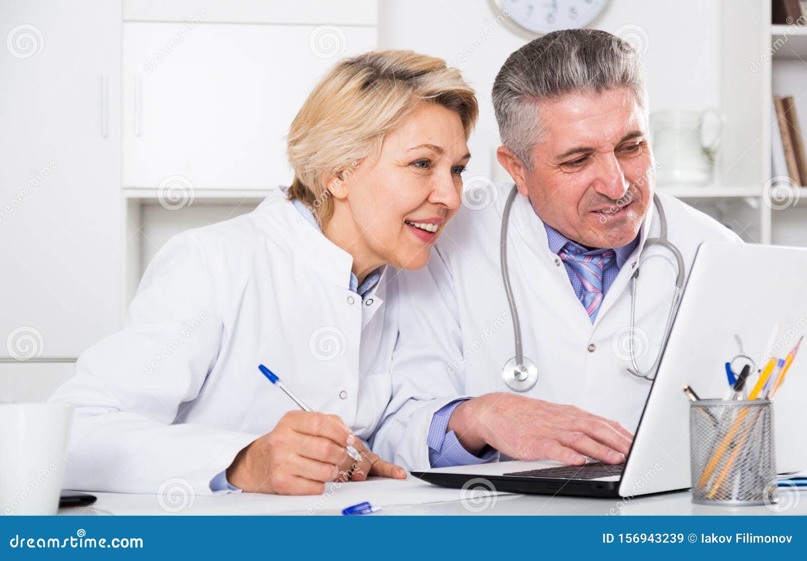 Doctor and Nurse Reading Information Stock Image - Image of medicine ...