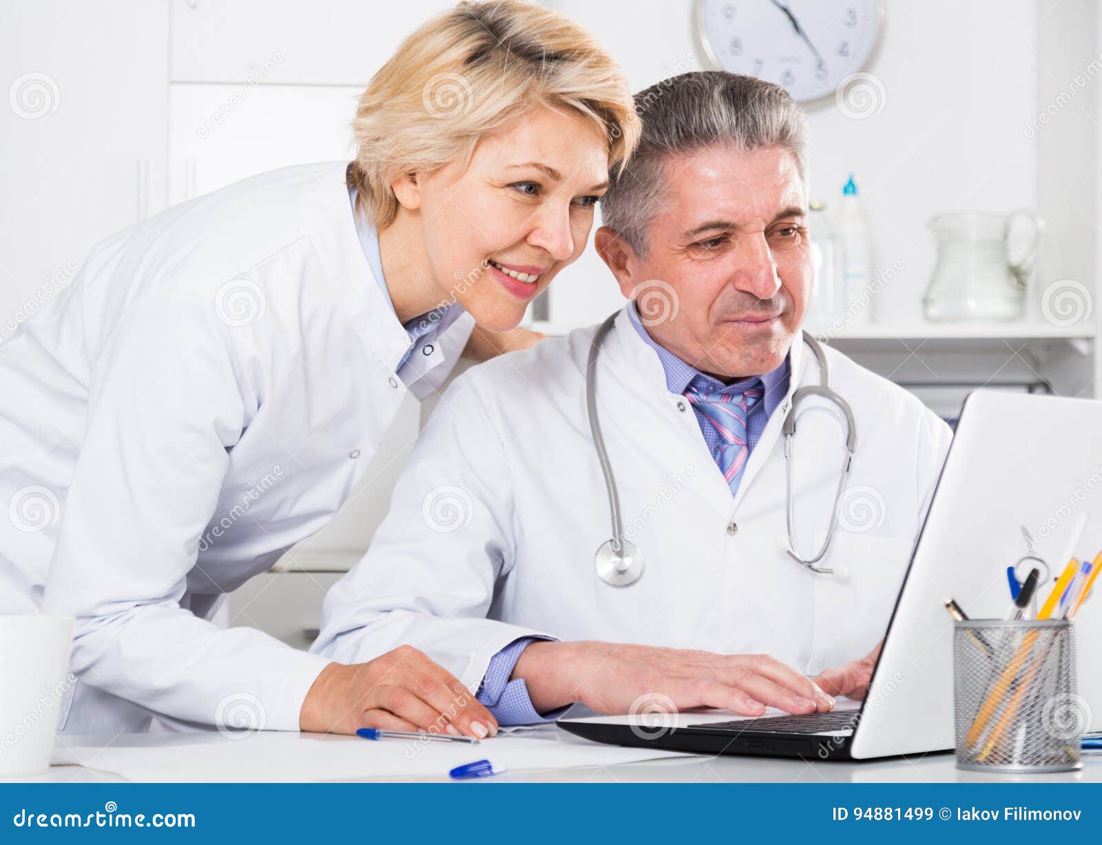 Doctor and Nurse Reading Information Stock Image - Image of american ...